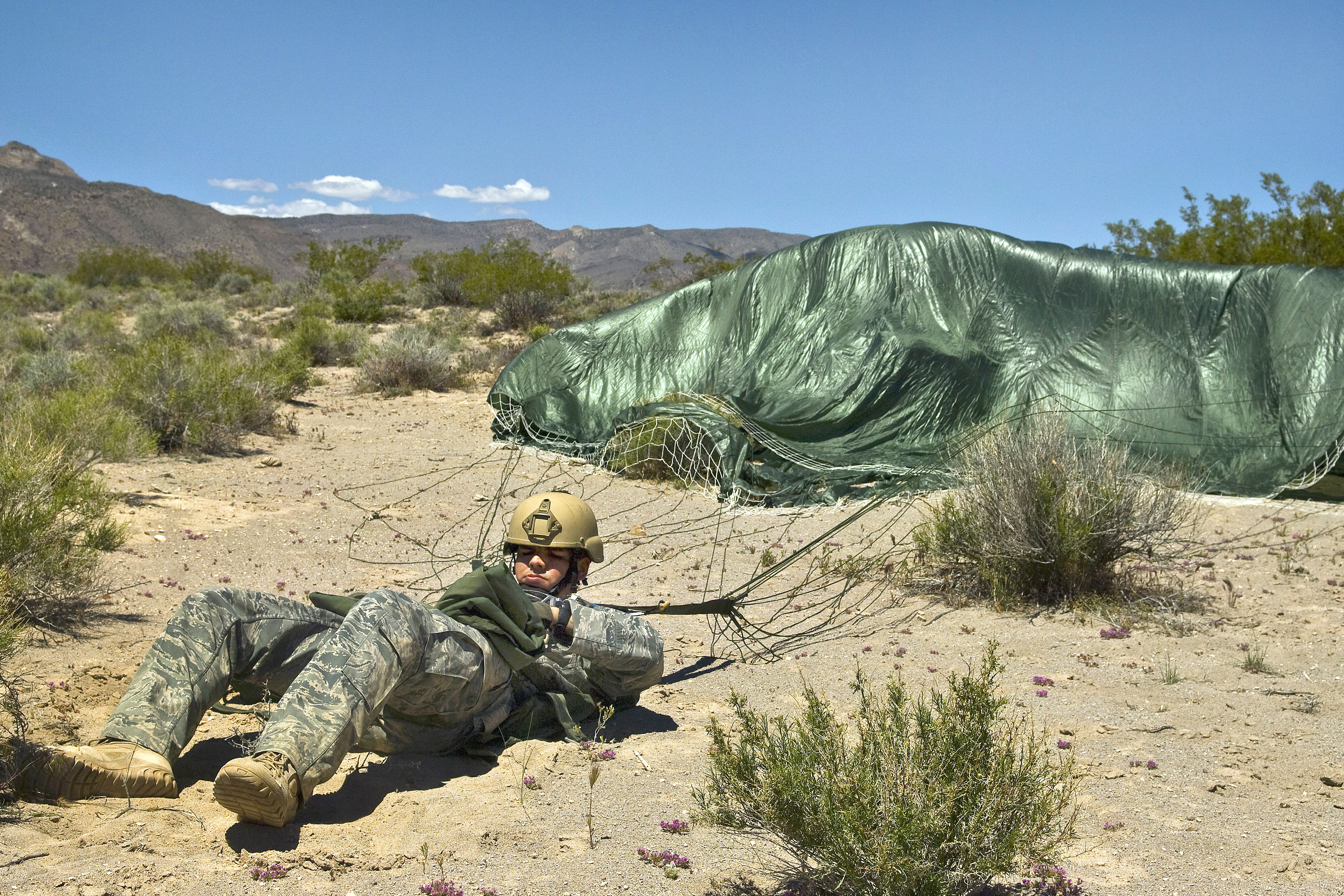 U.S. Air Force Tech. Sgt. Philip McAlpin starts to get up after landing ...