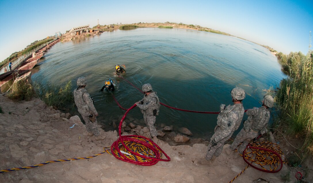 Divers with the 86th Engineer Dive Team exit the Euphrates River after ...