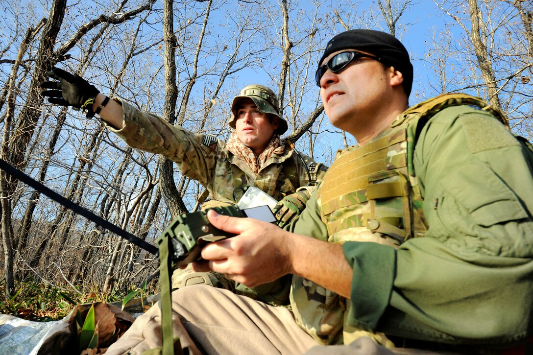 U.S. Air Force Staff Sgt. Robert Colliton, left, and Lt. Col. Pete ...