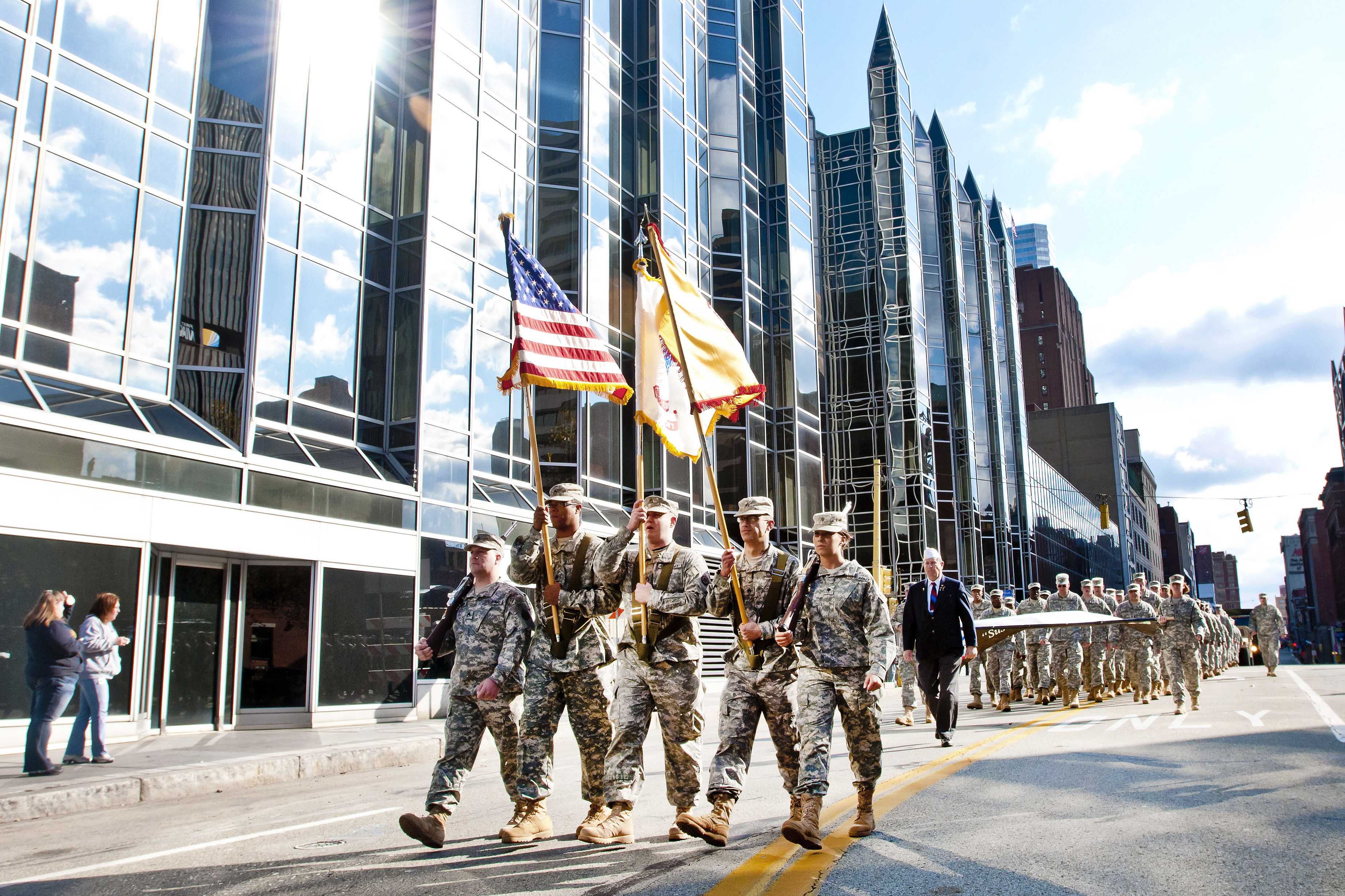 The Army Color Guard leads the way as Army Reserve soldiers march ...