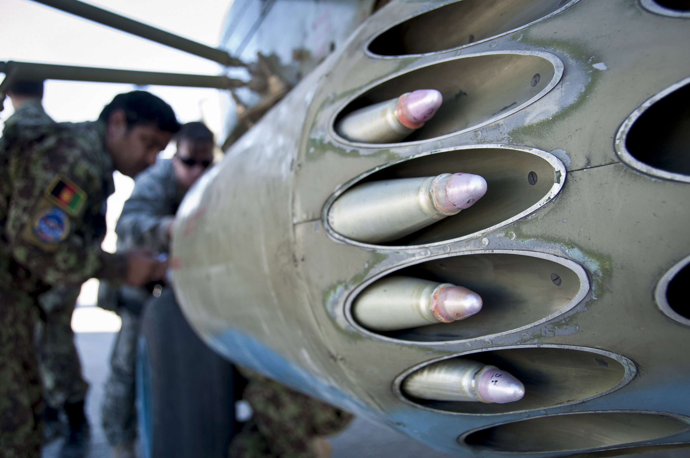 Afghan air force members load the rocket pod of a Mi-17 helicopter at ...