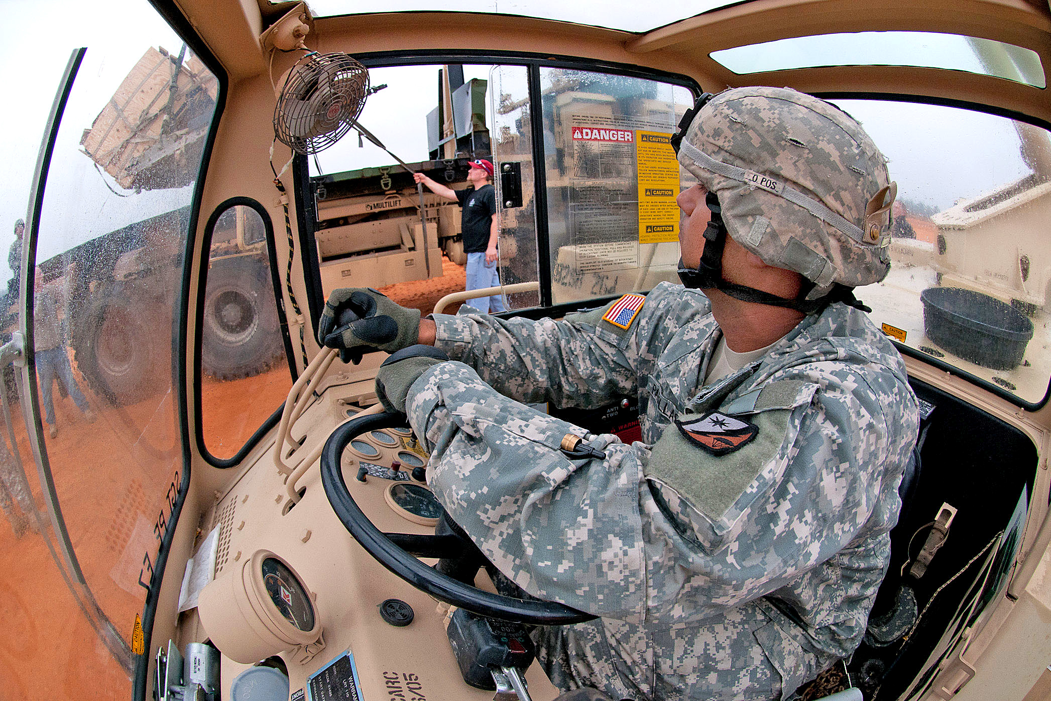 Army Sgt. Jose Pasillas maneuvers a test package of water blivets onto ...