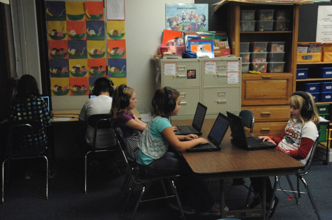 Students from Dr. Charles G. Barnum Elementary School work during class ...