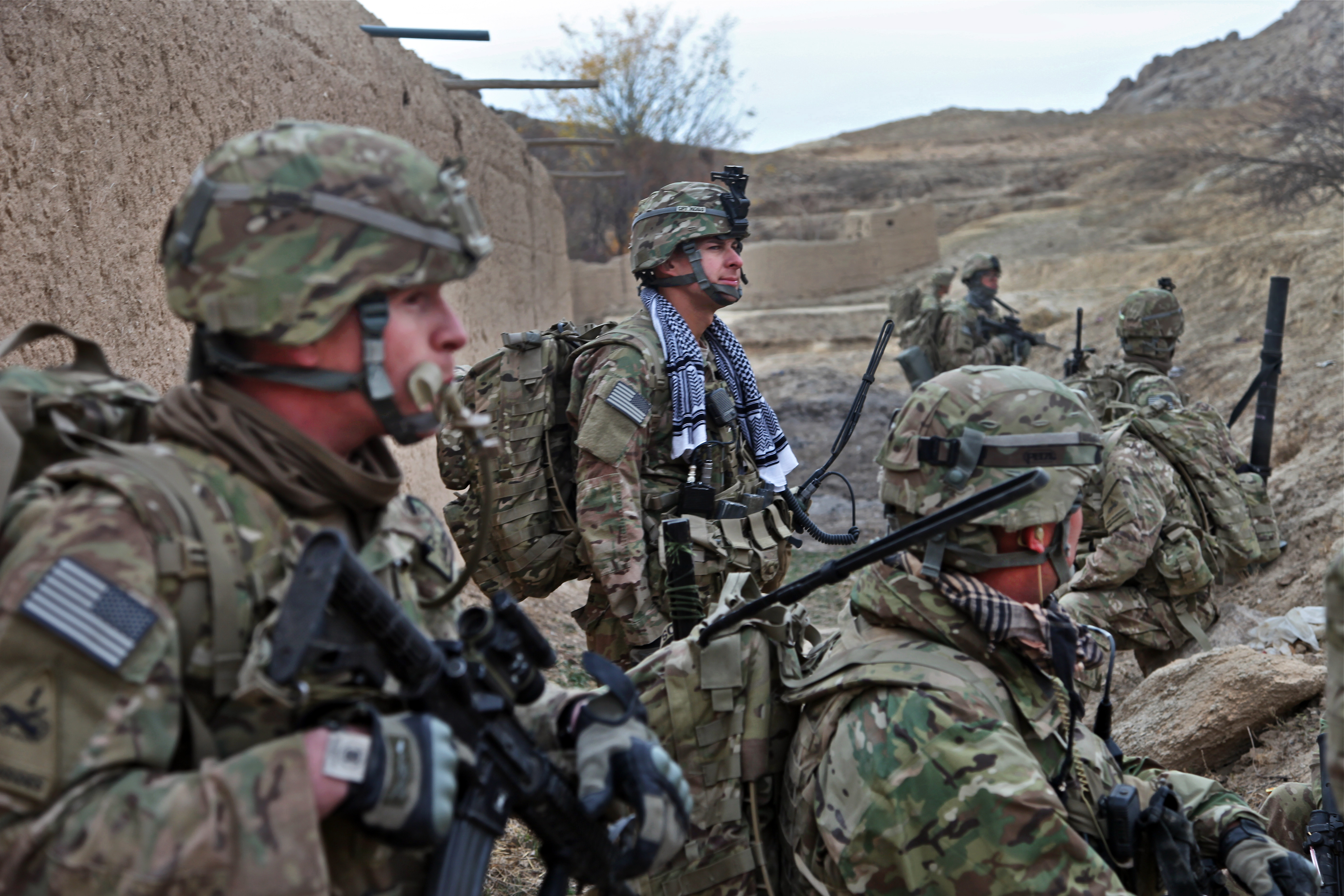 U.S. soldiers prepare to cross a road in Dondokay village in the Sayed ...