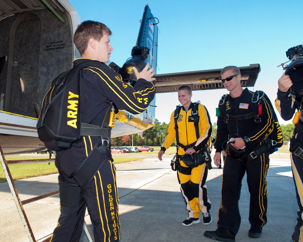 A photographer with the Army Golden Knights Parachute Team videotapes ...