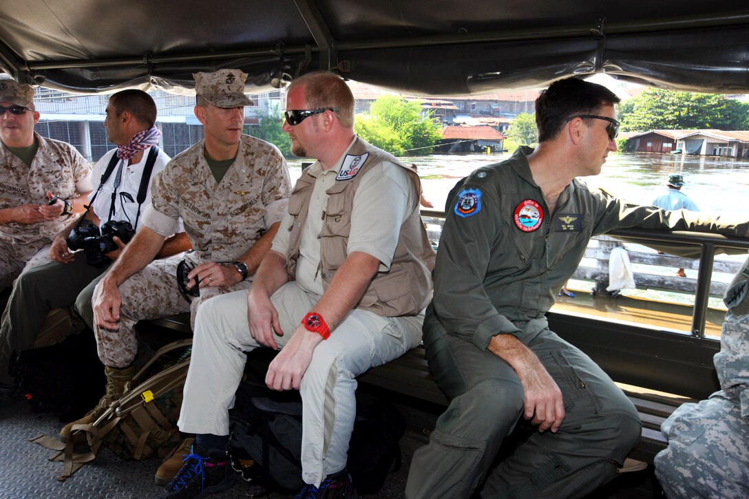 U.S. Marine Corps Col. John A. Ostrowski, third from left, speaks with ...