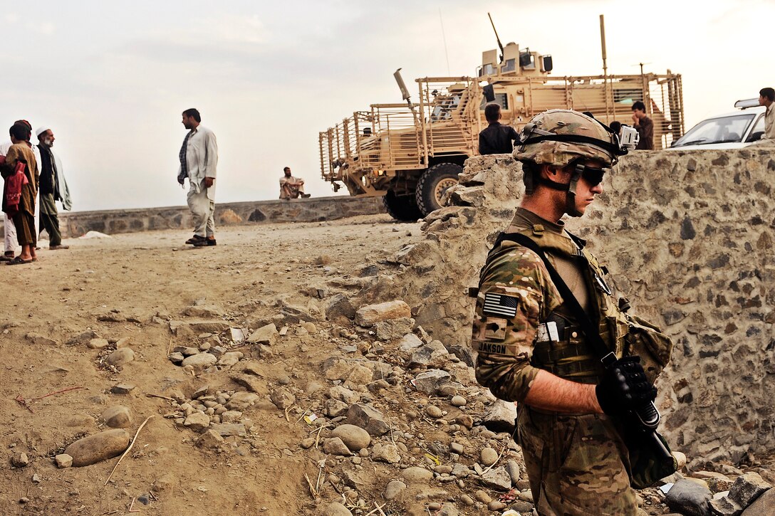 U.S. Army Spc. Jeff Jakson escorts engineers down to the Jugi bridge in ...