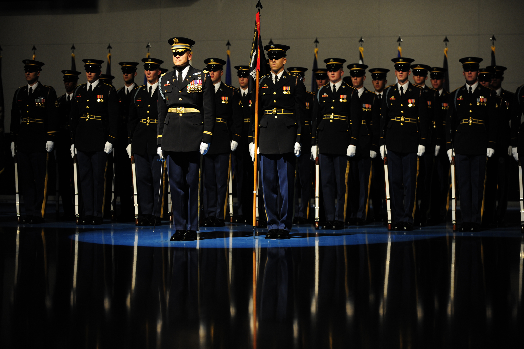 U.S. Army honor guard members stand at attention during the change-of ...