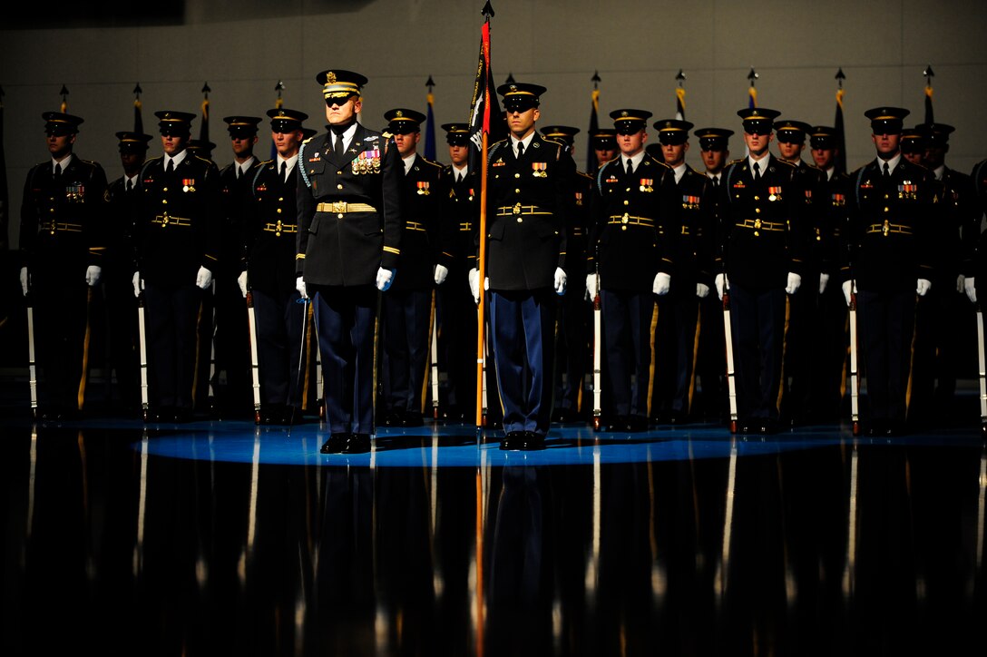 U.S. Army honor guard members stand at attention during the change-of ...