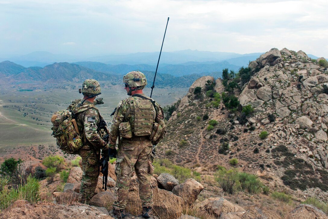 U.S. Army 1st Sgt. John Orbe and 1st Lt. Andrew Brunsdon scout a route ...