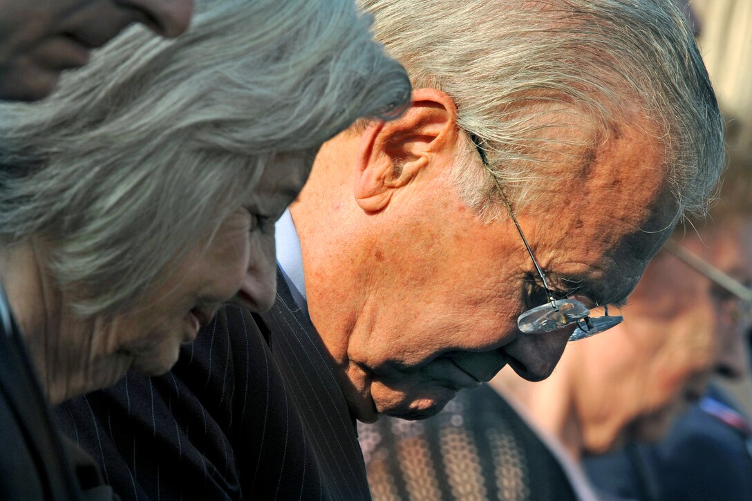 Former Defense Secretary Donald H. Rumsfeld and his wife, Joyce, pause ...