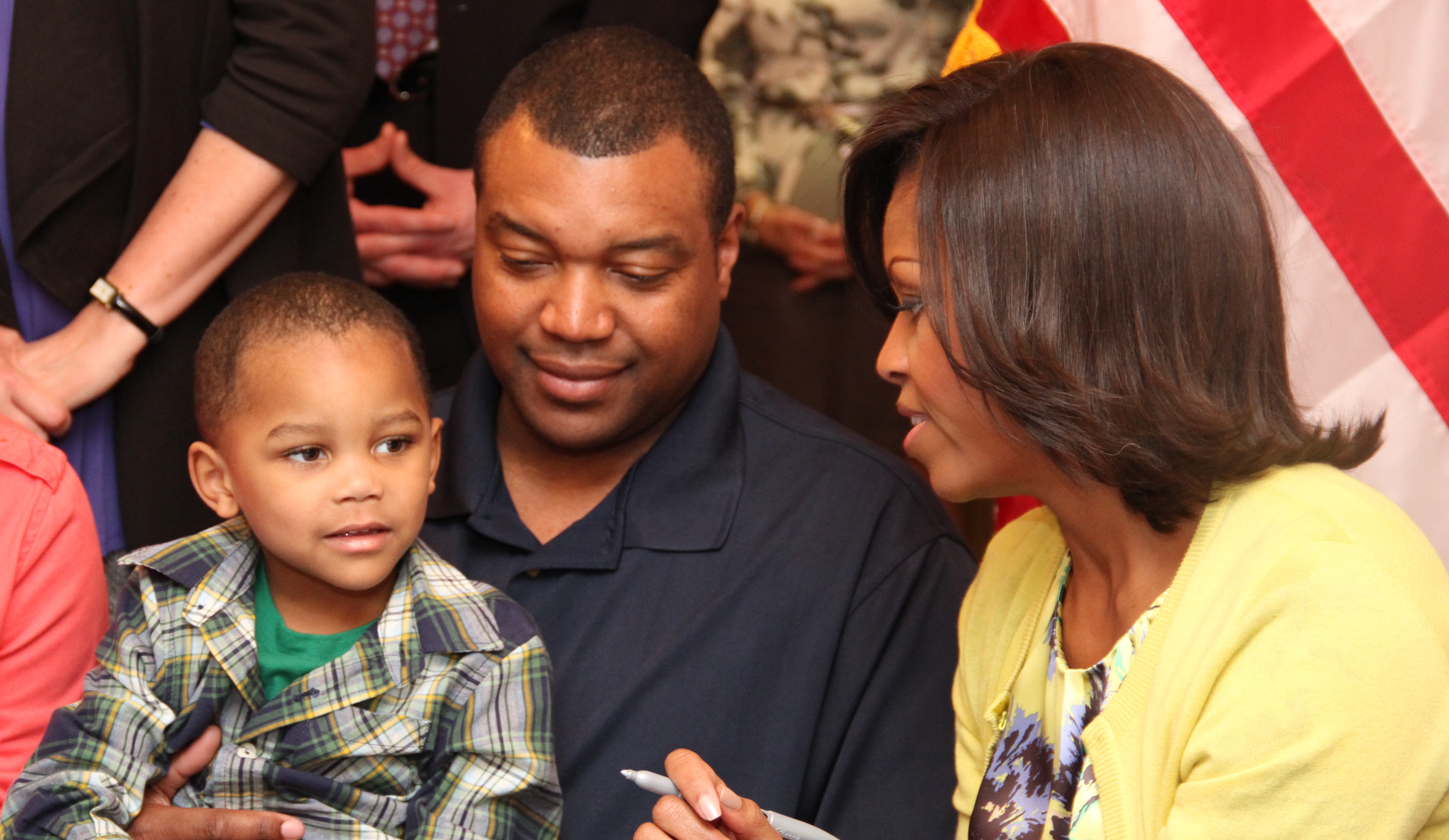 First Lady Michelle Obama greets 4-year-old Eun White at Fisher House ...