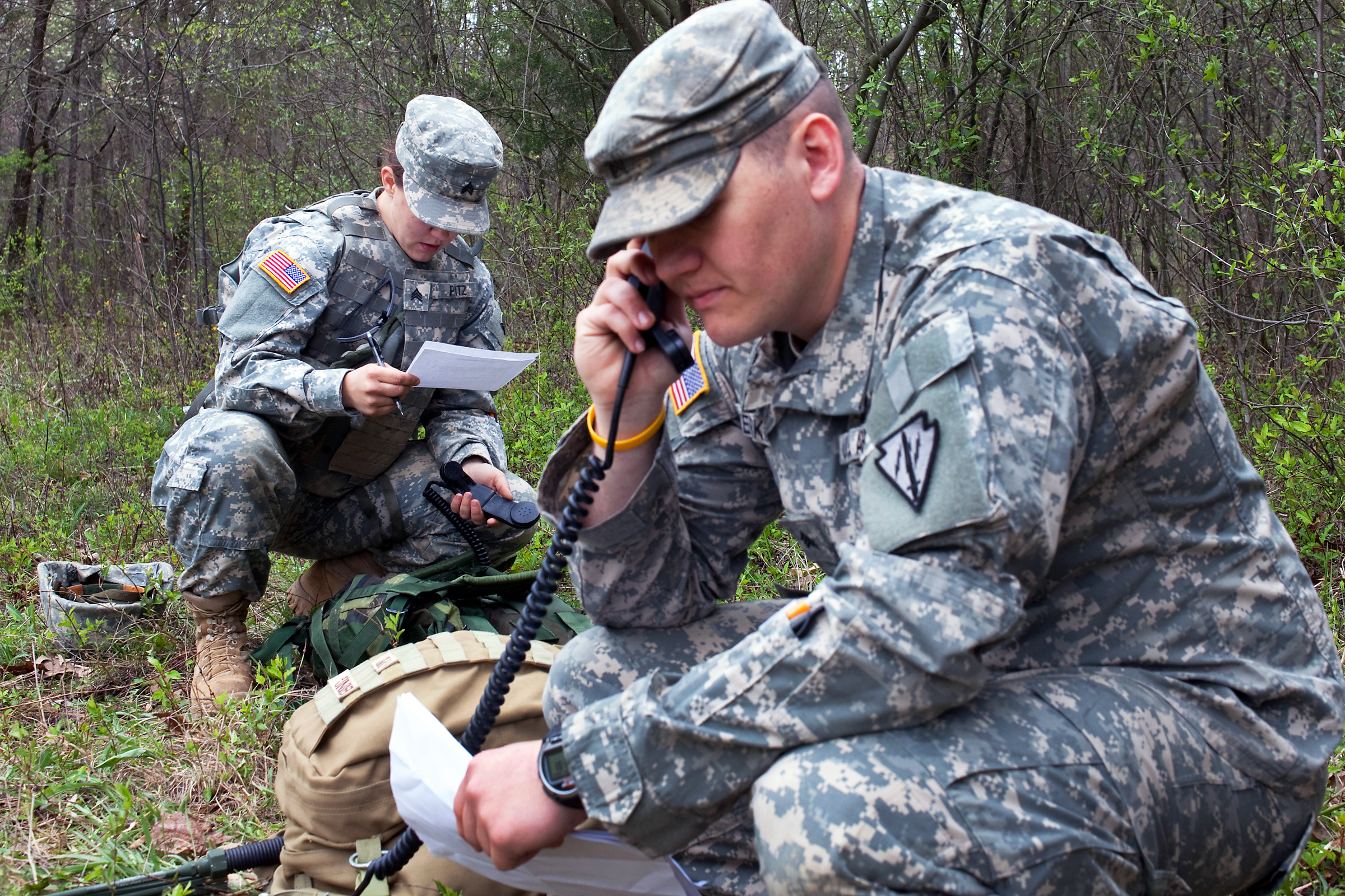 Army Sgt. Mollie Pitz, left, authenticates and communicates a situation ...