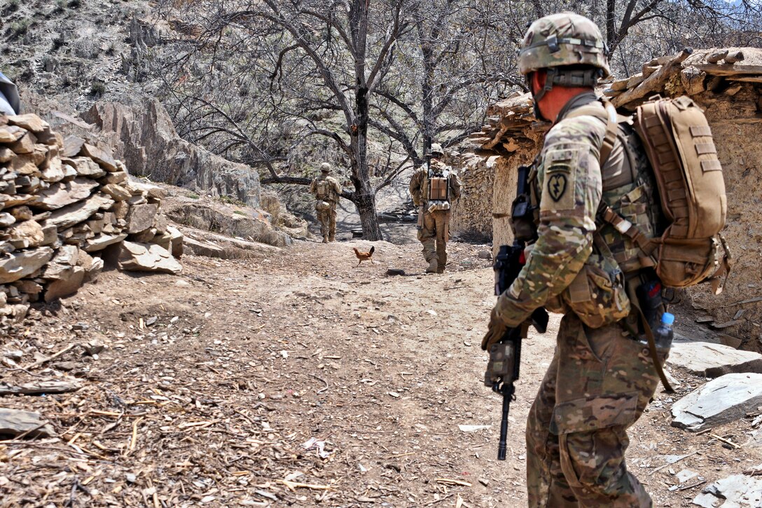 U.S. Army Spc. Tyler Noyes patrols with fellow soldiers during ...
