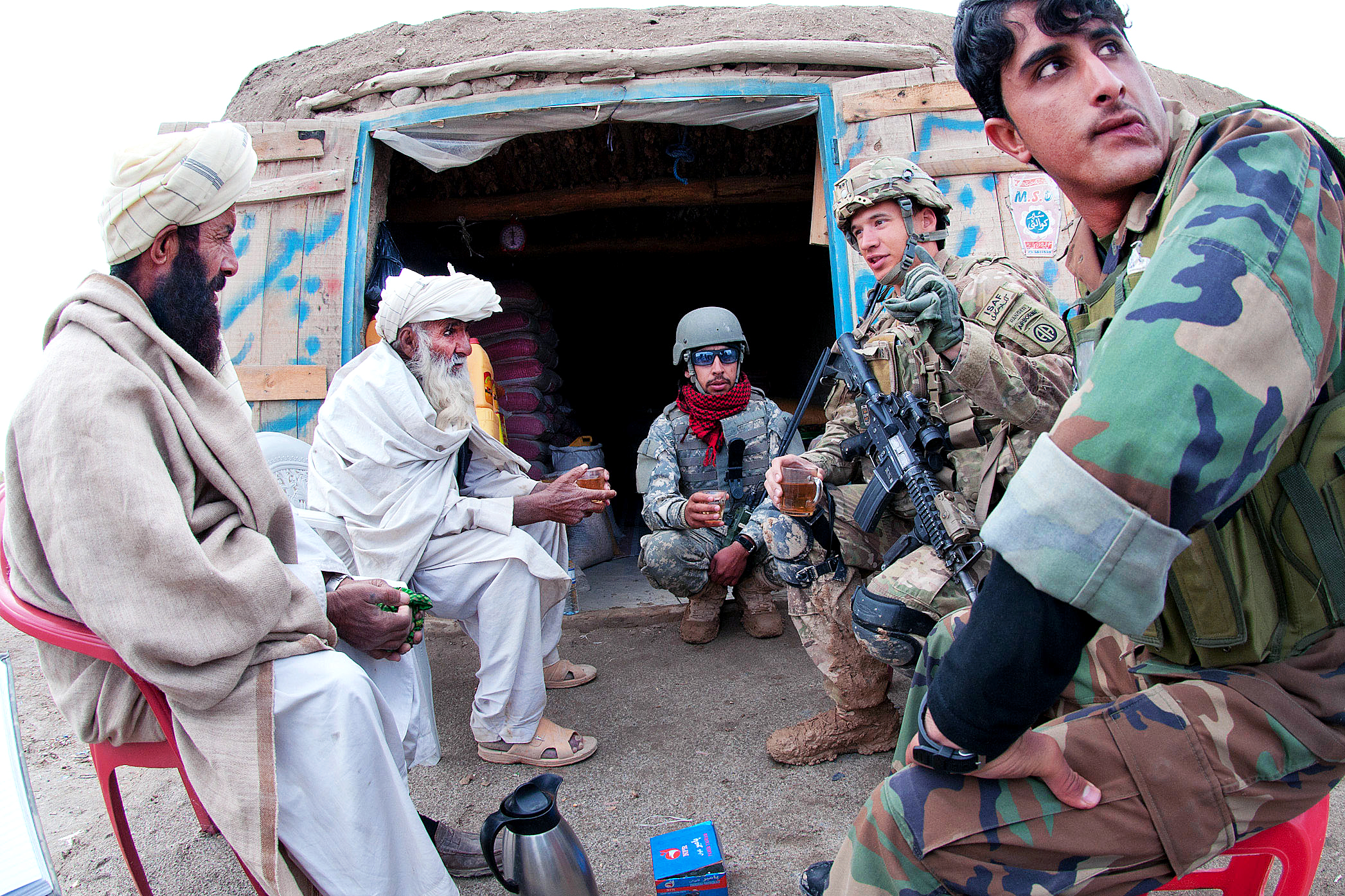 U.S. Army 2nd Lt. Anthony Pappas drinks chai with village elders while ...