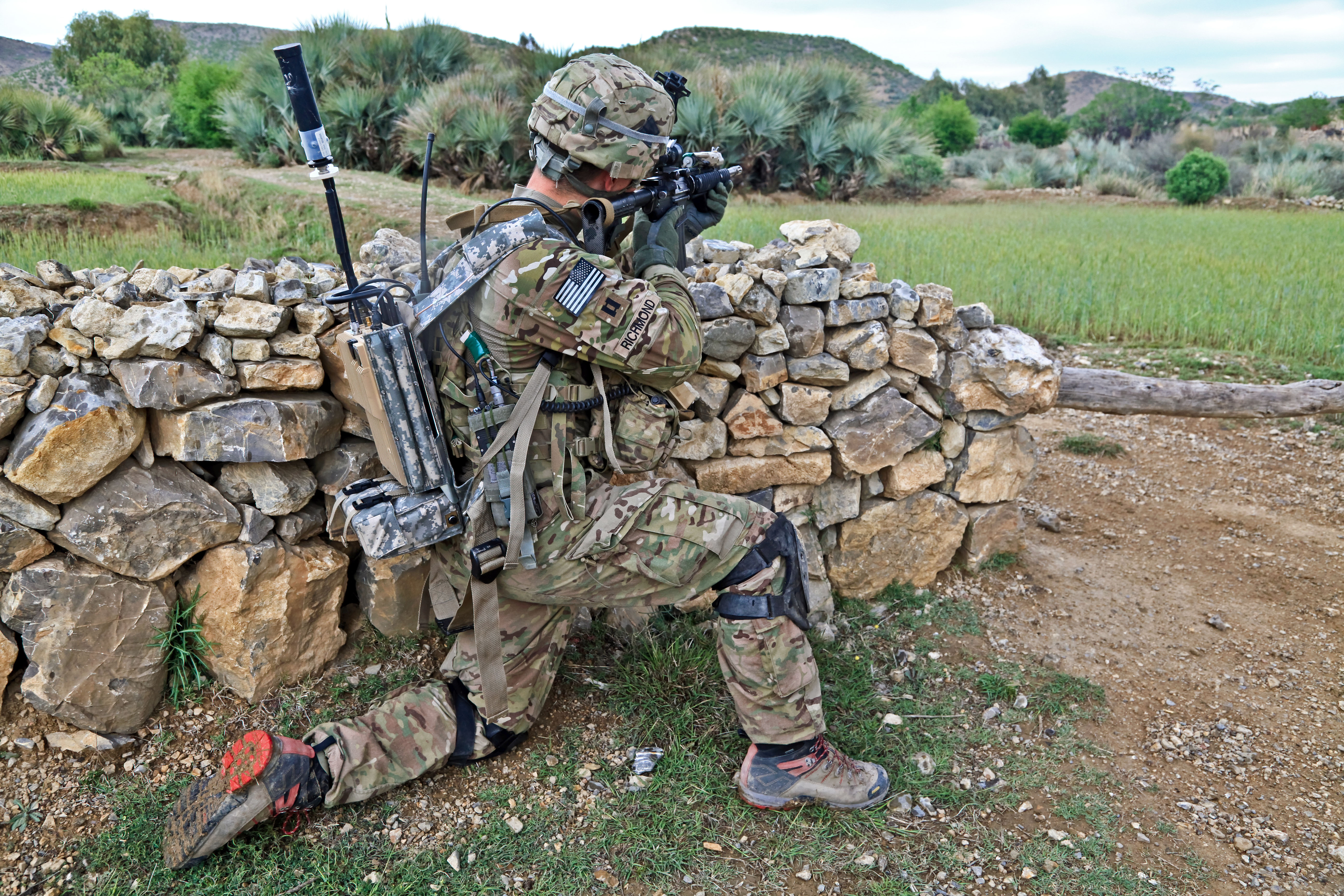 U.S. Army Cpt. Gordon Richmond provides security while on patrol during ...