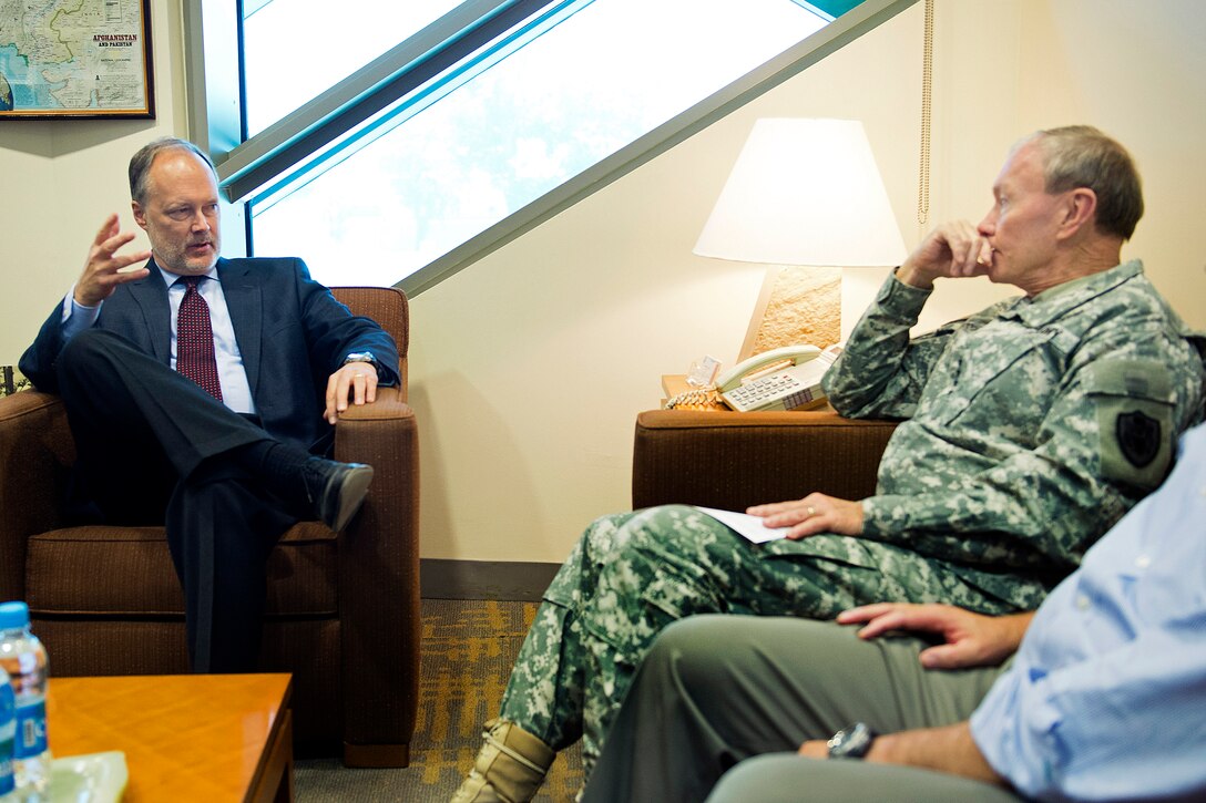 U.S. Ambassador James Blair Cunningham, left, talks with U.S. Army Gen ...
