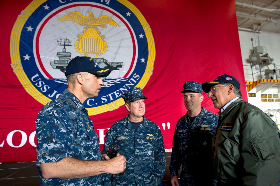 Defense Secretary Leon E. Panetta speaks with Navy Captain Ron Reis ...