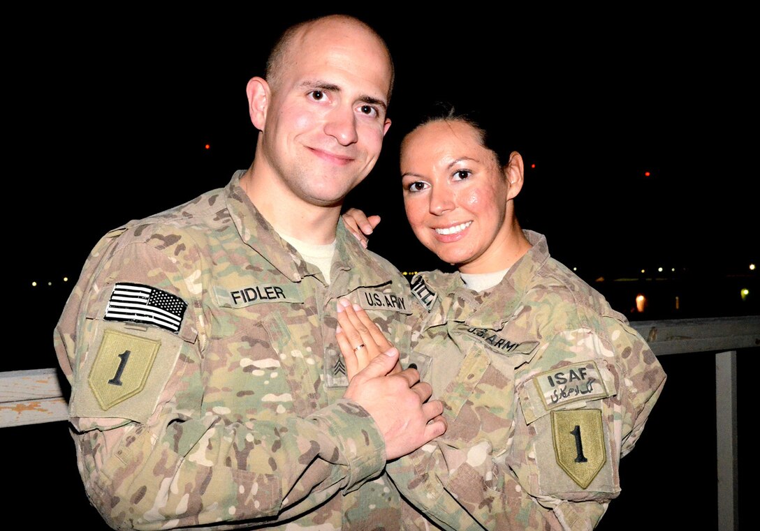 Newlyweds Army Sgt. Drew Fidler and Army Spc. Michelle Williams are ...