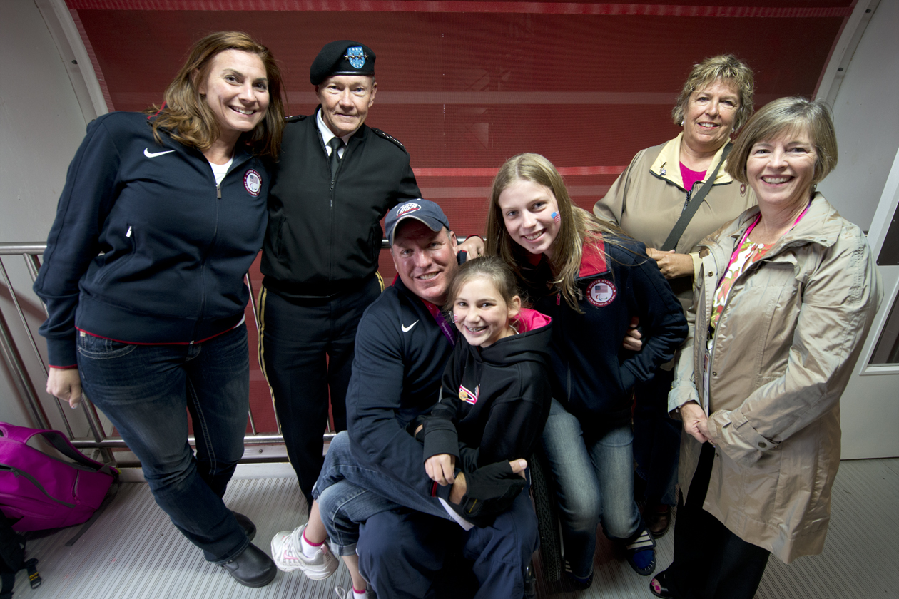 Retired U.S. Army 1st Sgt Class Josh Olson and his family pose for a ...