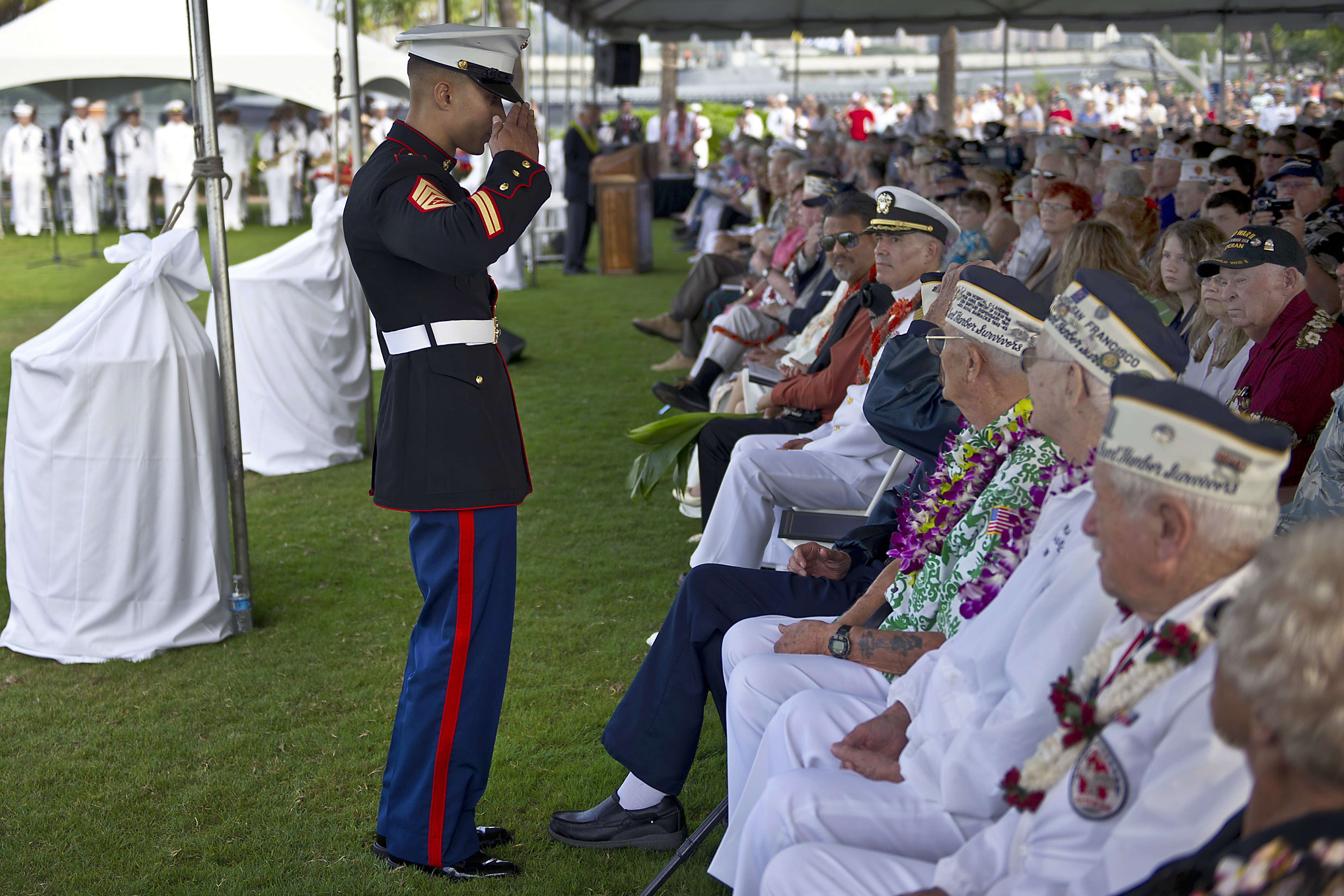 U.S. Marine Corps Staff Sgt. Stephen Cameron, left, salutes former Navy ...