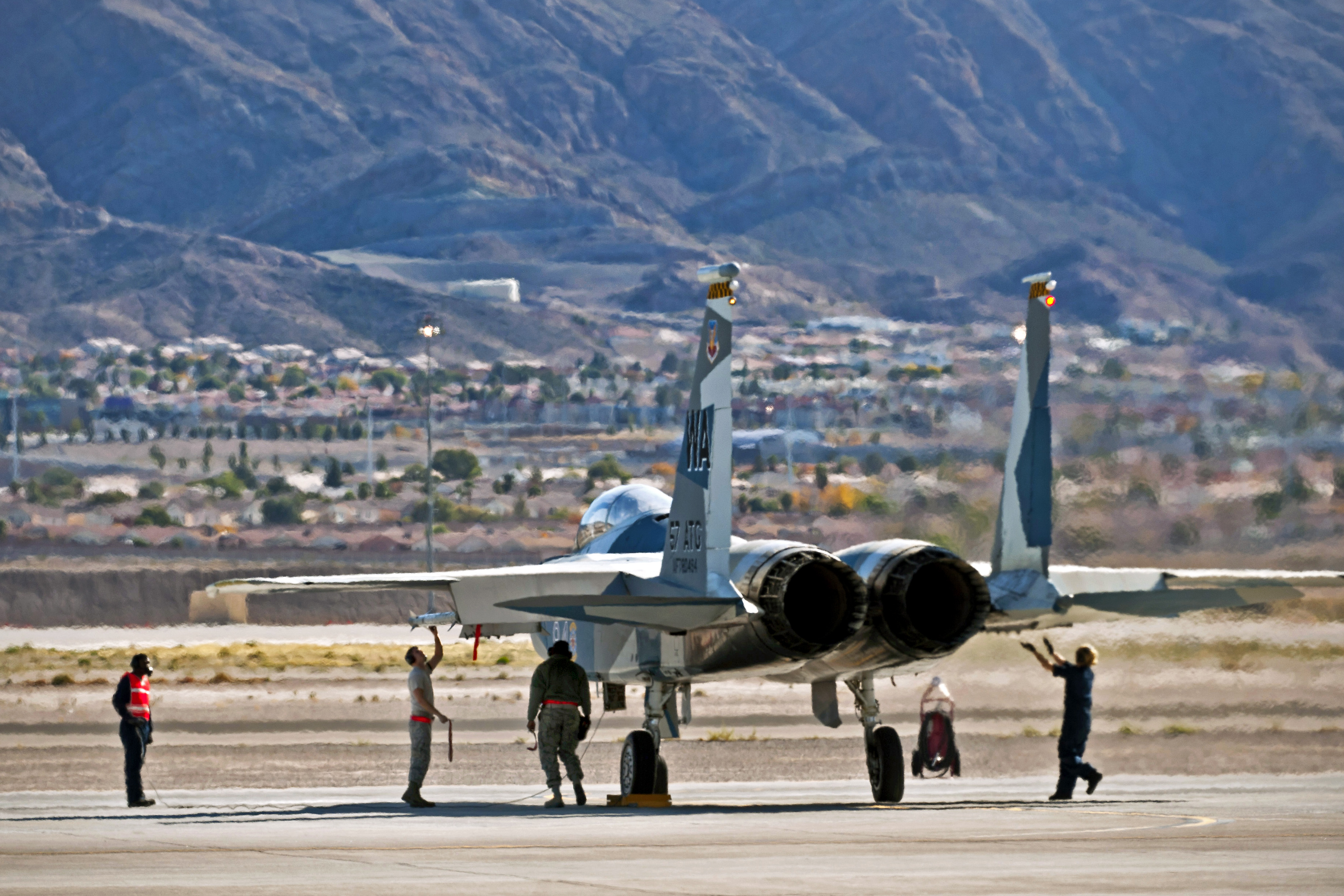 Air Force crew chiefs conduct pre-flight checks during a mission ...