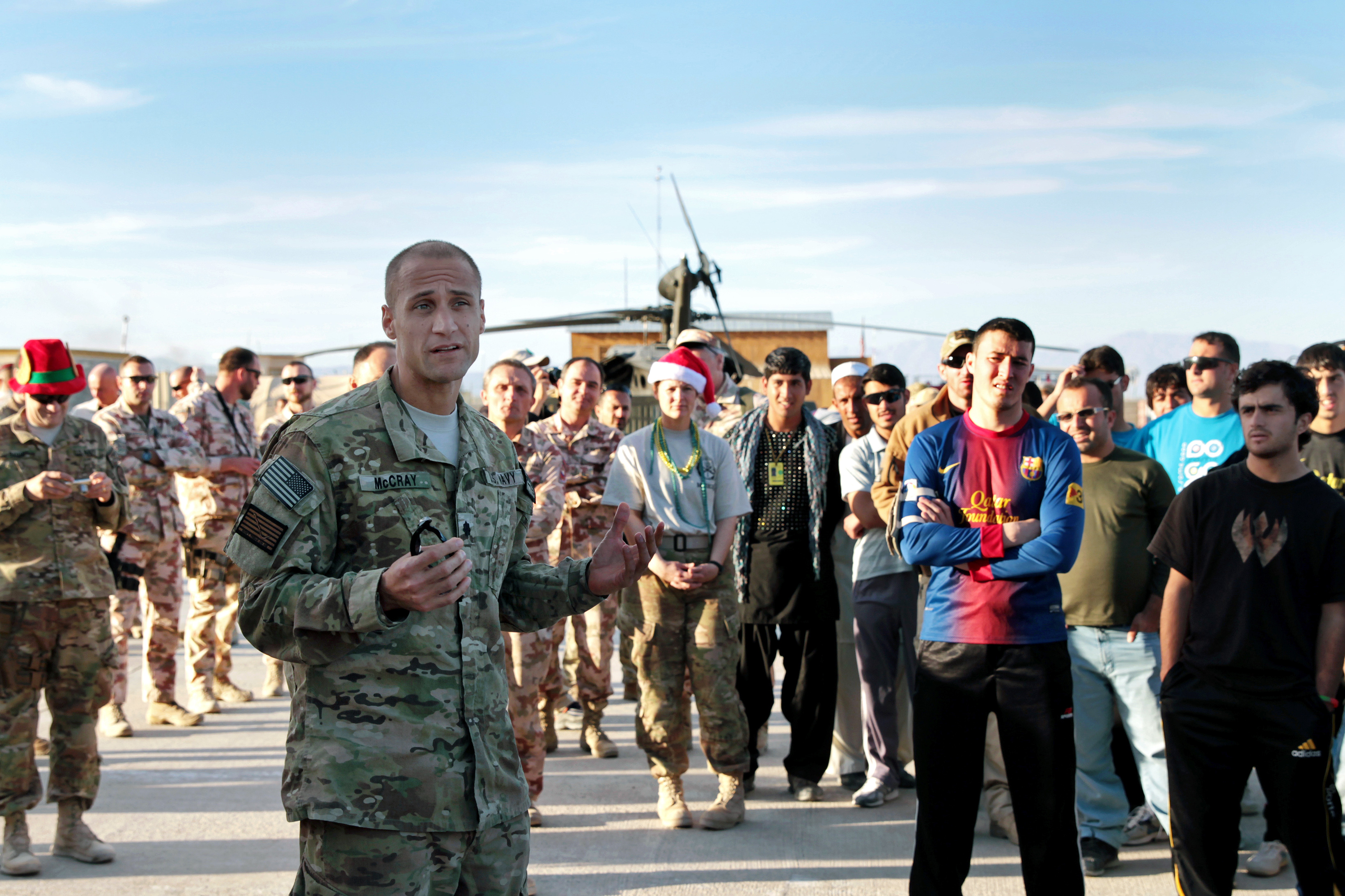 U.S. Navy Cmdr. Louis McCray, center, addresses American, Italian and ...