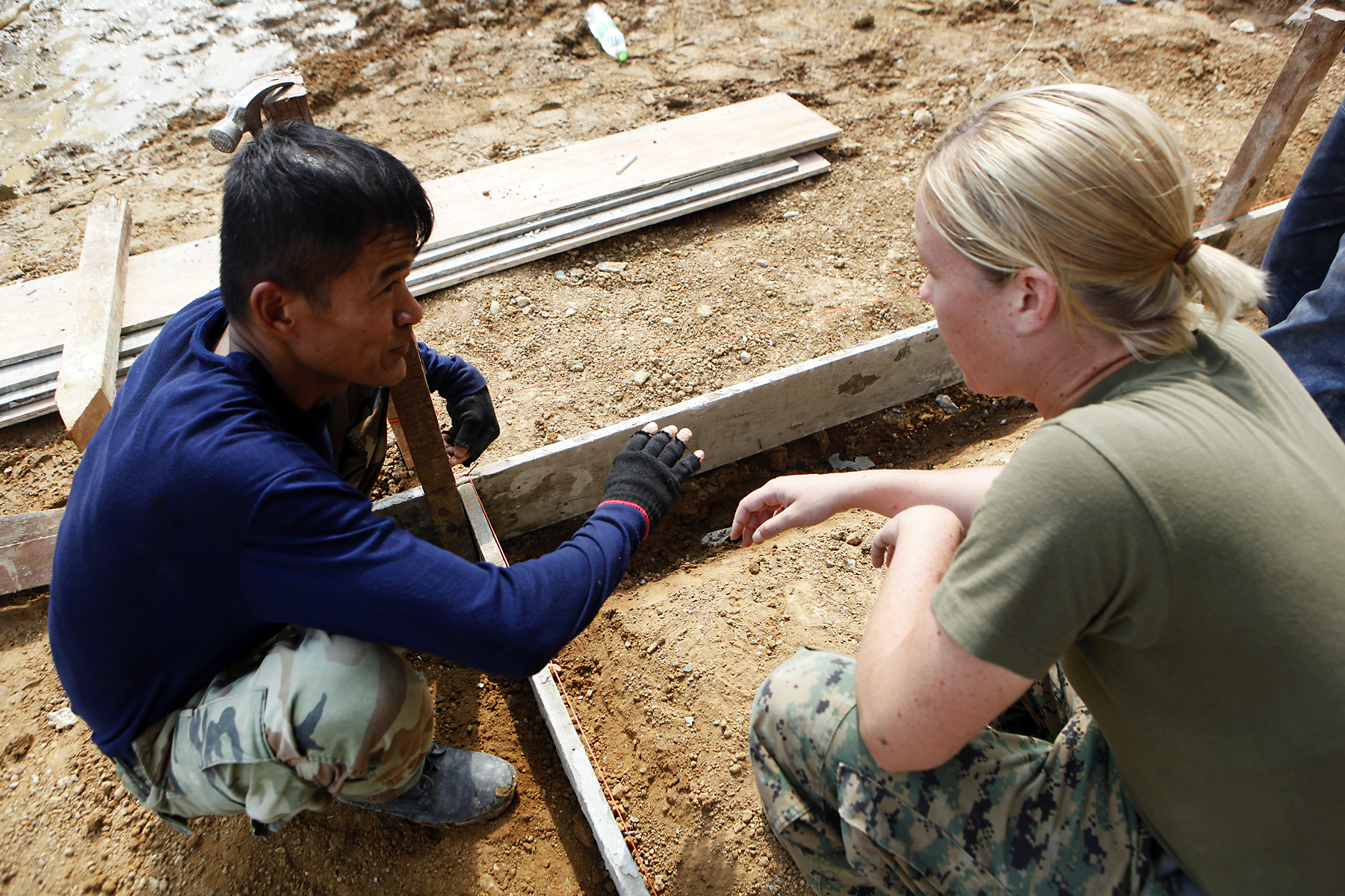 Thai navy Chief Petty Officer 1st Class Nopporn Singpet, left, explains ...