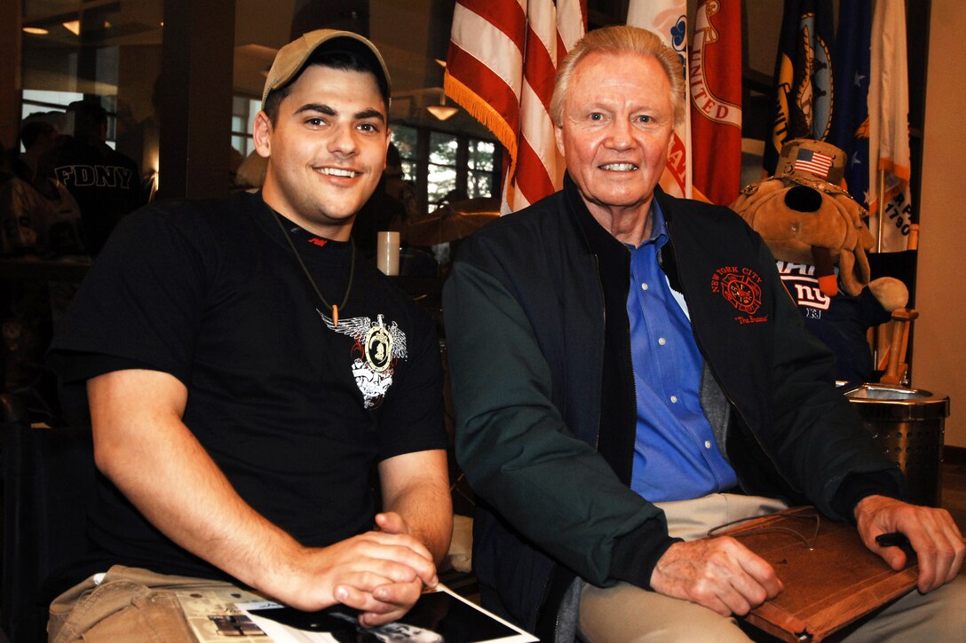 Actor Jon Voight, right, poses for a picture with a wounded warrior ...