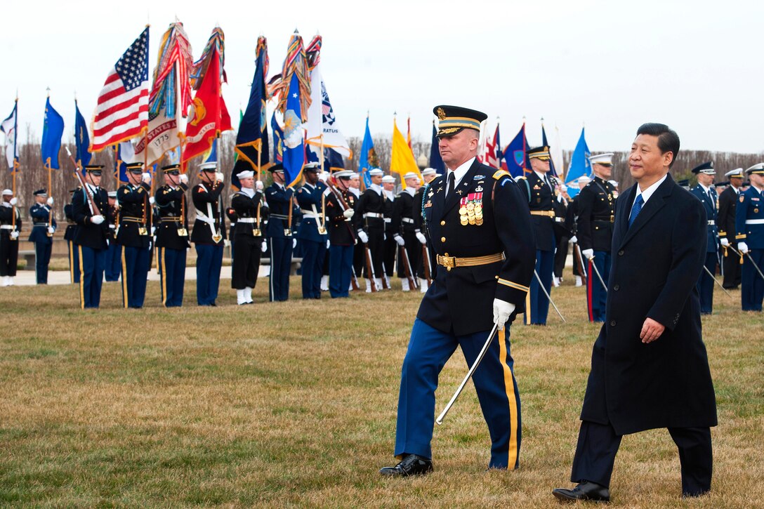 U.S. Army Col. David P. Anders, left, escorts Chinese Vice President Xi ...