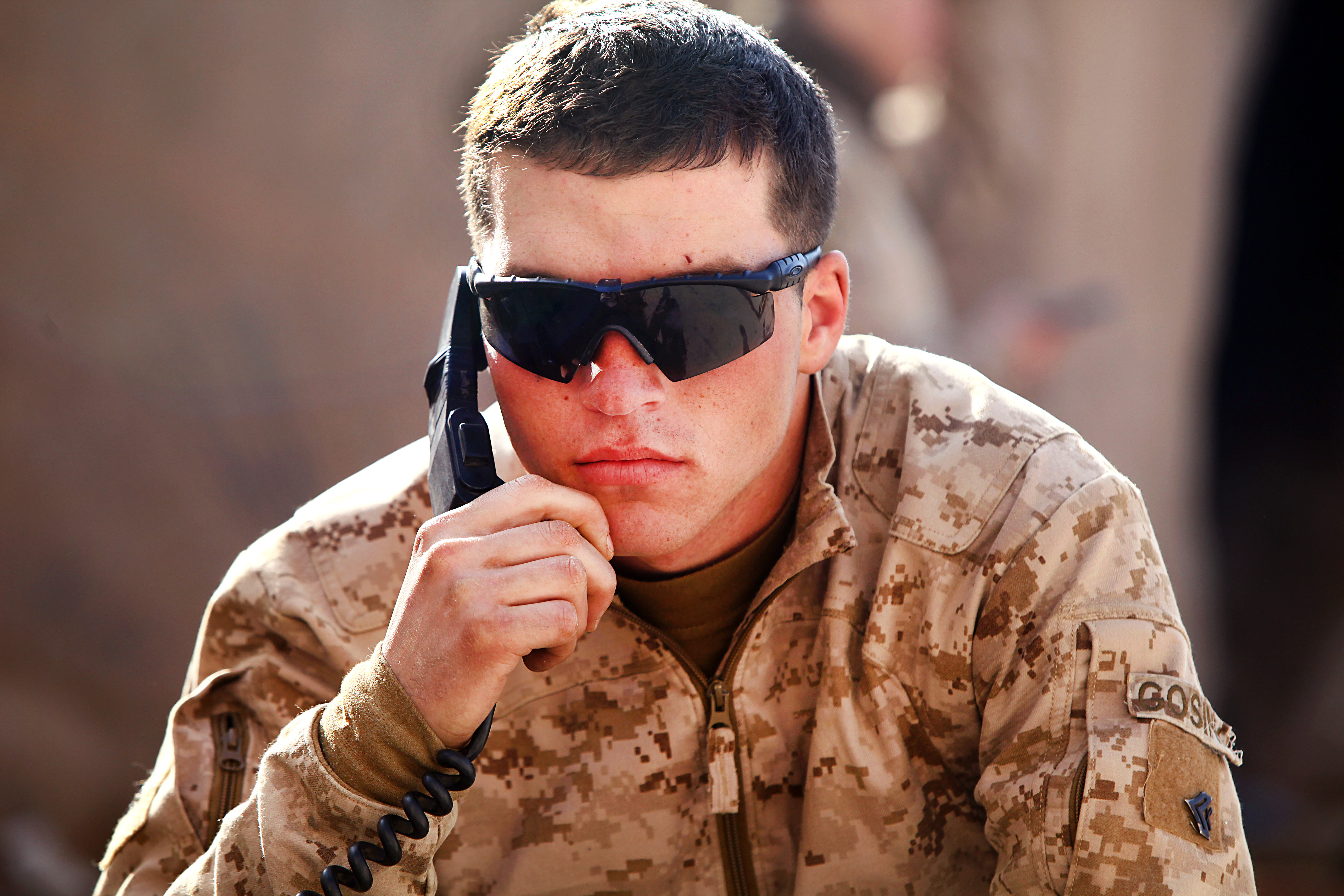 U.S. Marine Corps Cpl. Andrew Gosinki radios to a command post during ...