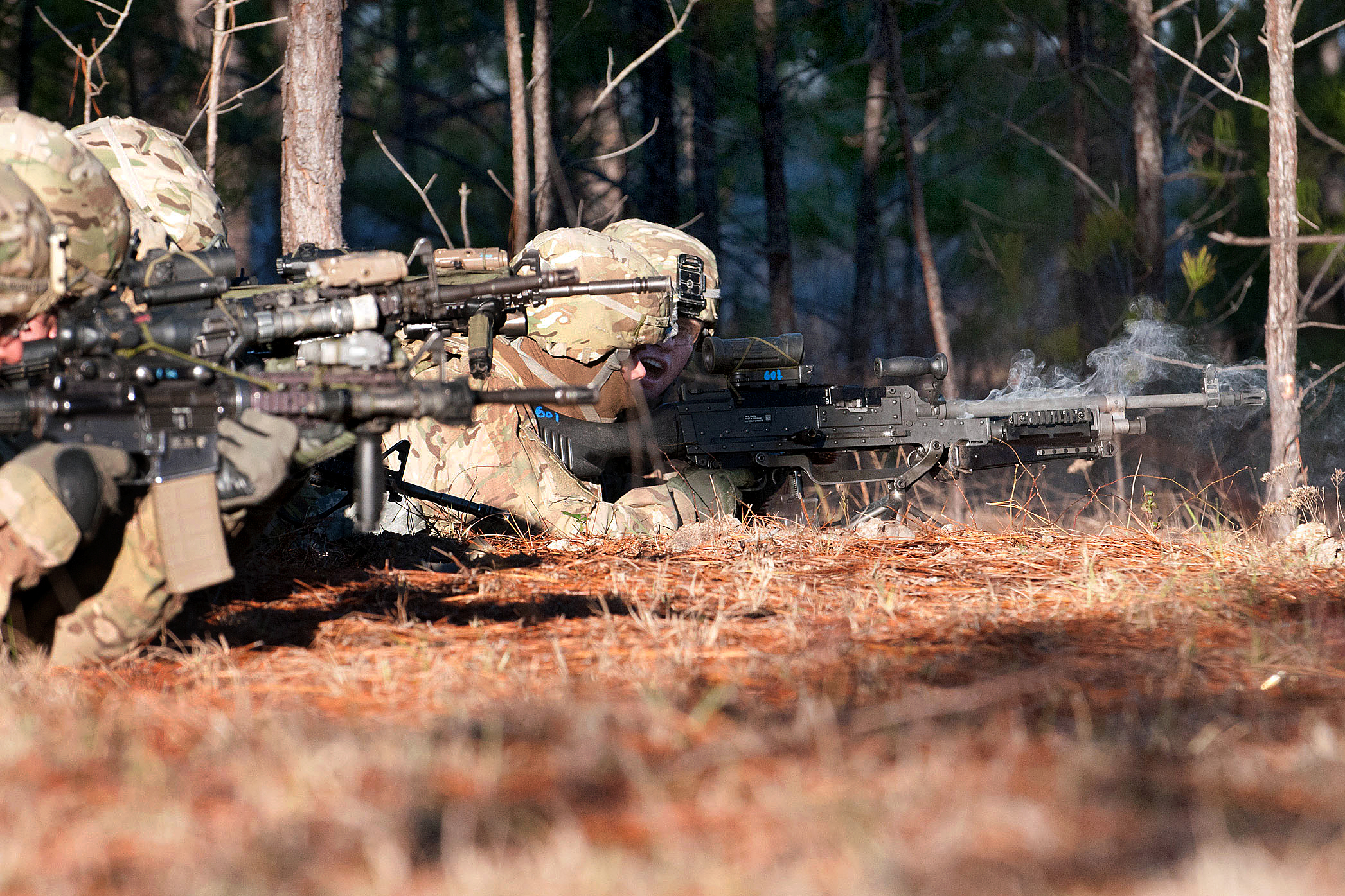 Smoke rises off the barrel of an M240B machine gun during a live-fire ...