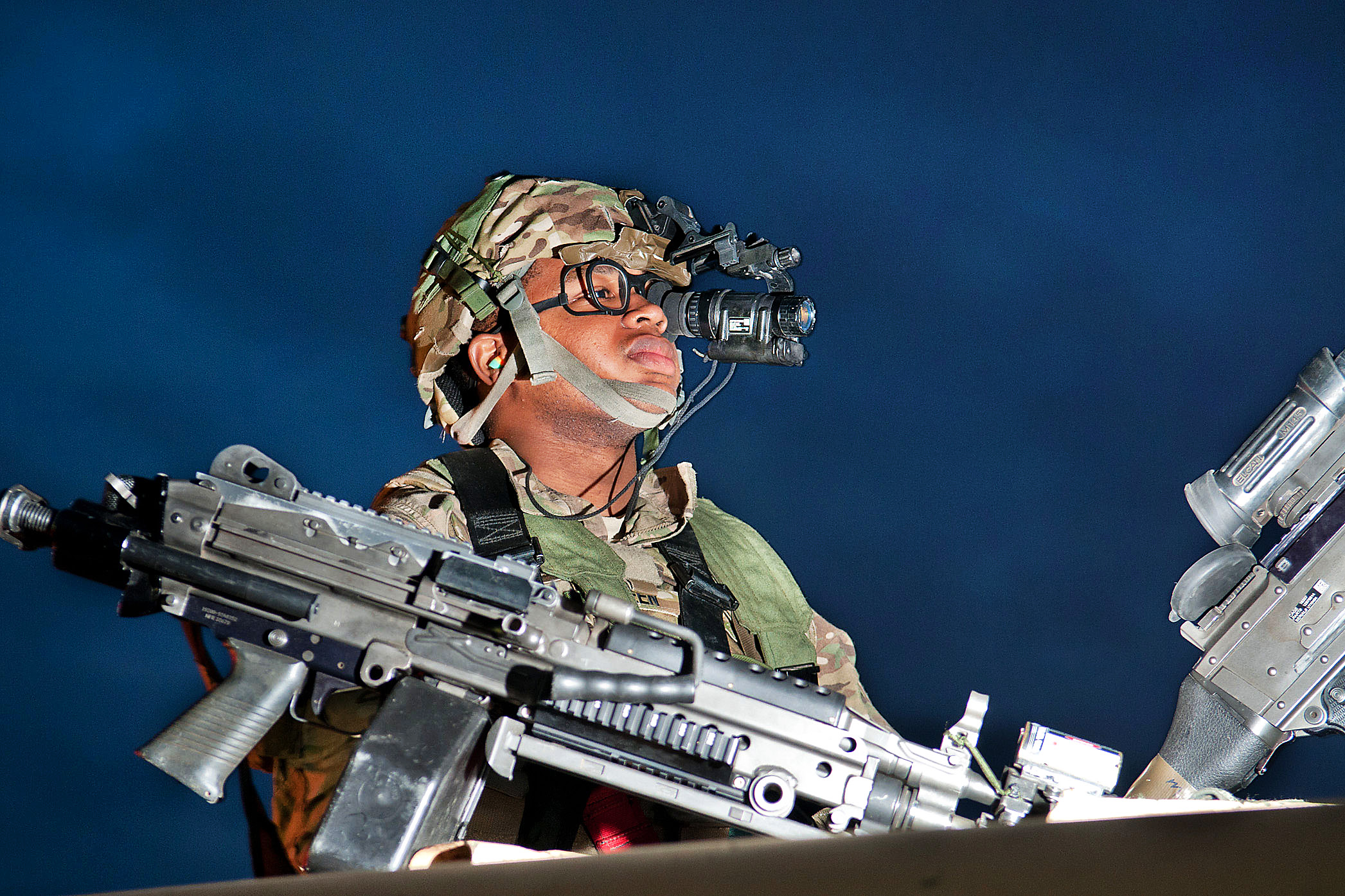 Army Pvt. Rodrell Green mans an M240 B machine gun atop a Humvee during ...