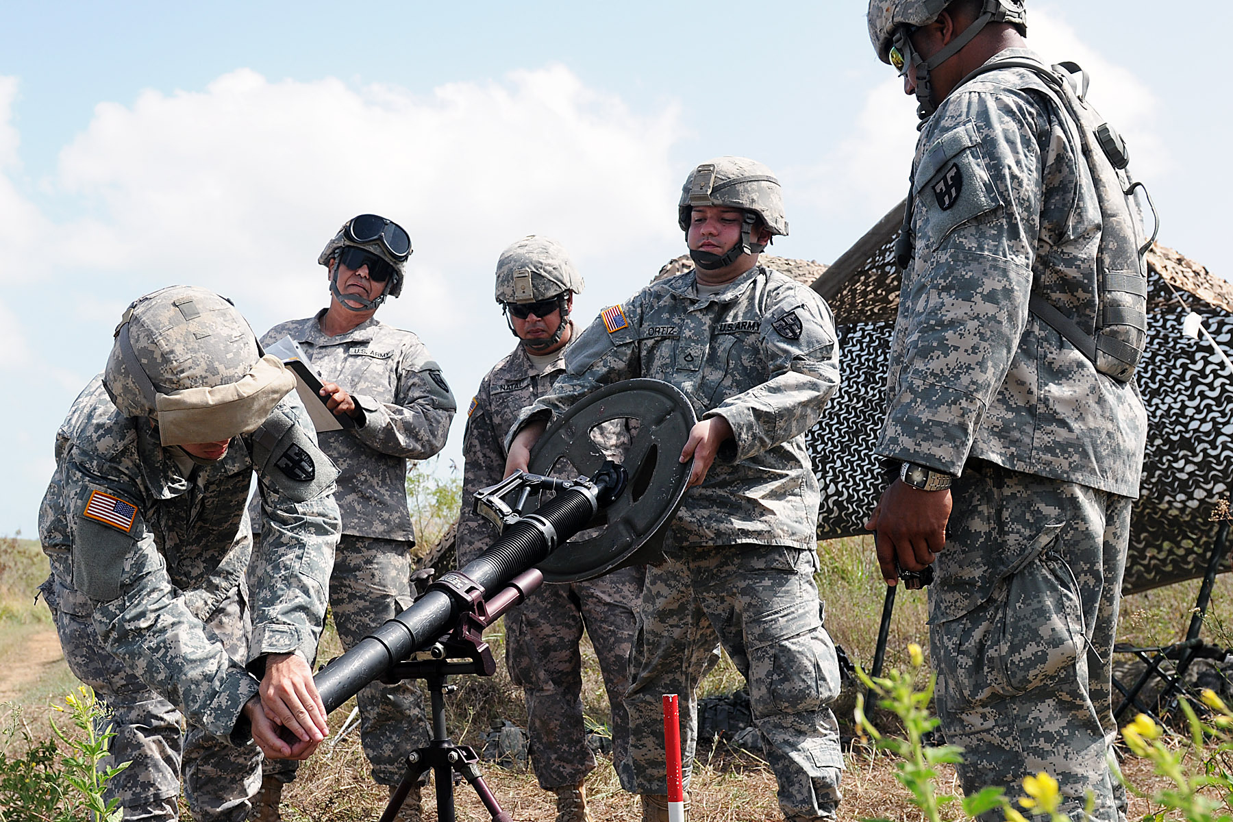 Army Sgt. Jose L. Ocasio, left, conducts training on how to remove a ...