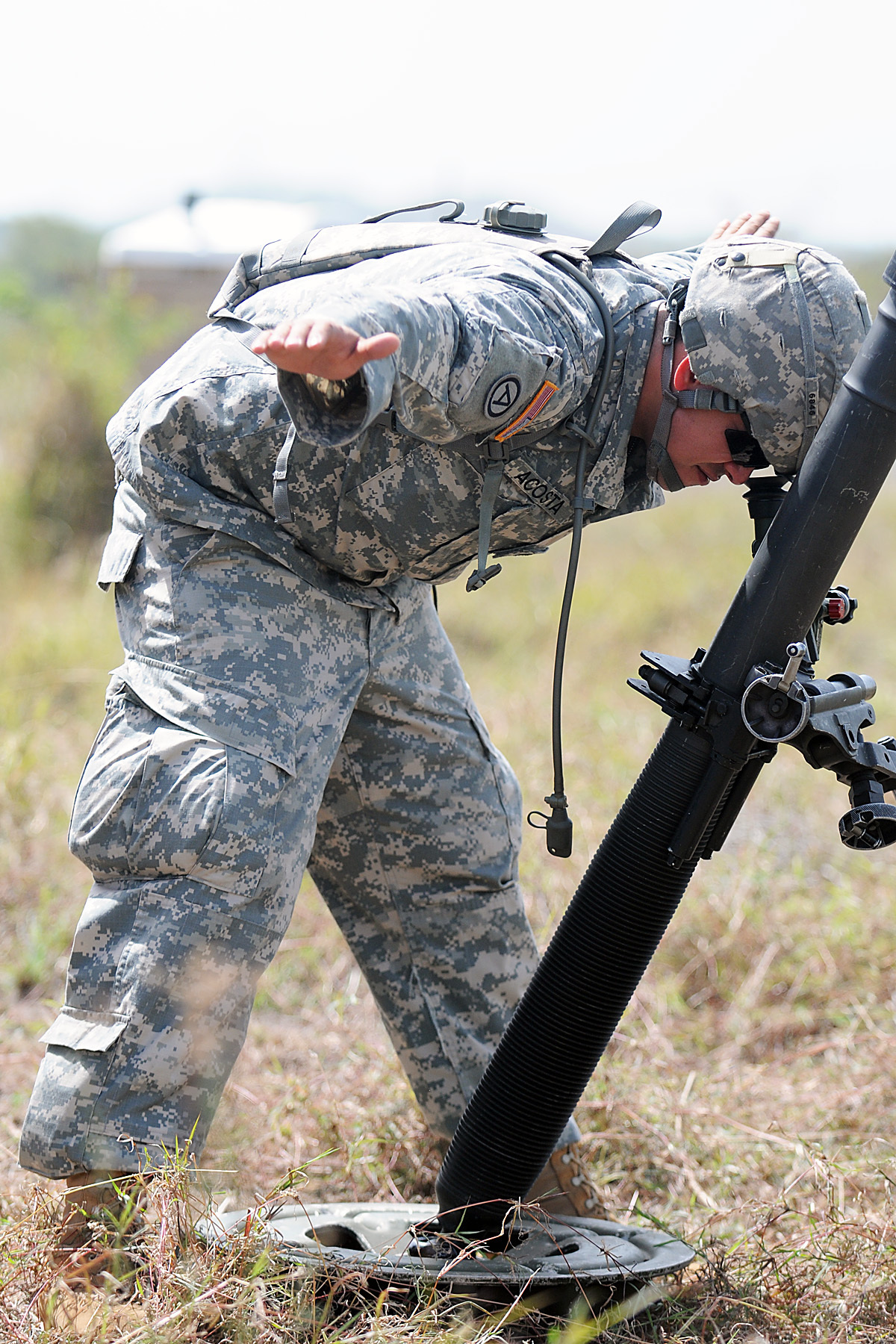 Army Spc. Martin Acosta adjusts the sight of his 81mm mortar during ...