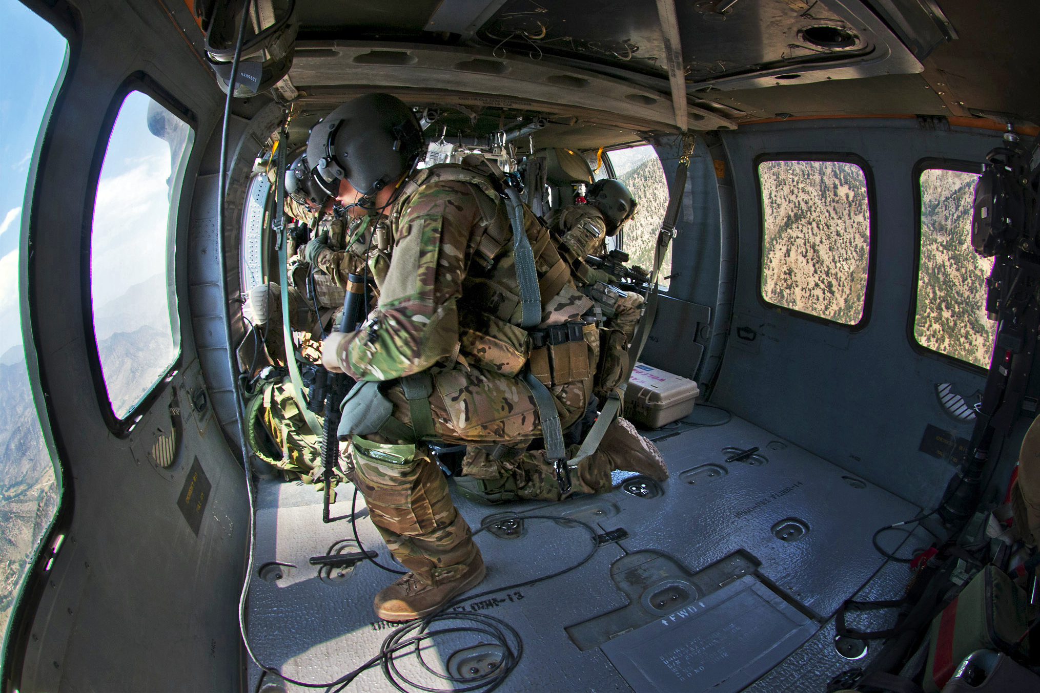 U.S. Air Force Lt. Col. Brett Wood, front, U.S. Army Staff Sgt. Patrick ...