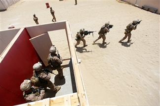 U.S. Marines move between buildings during close-quarters combat training
