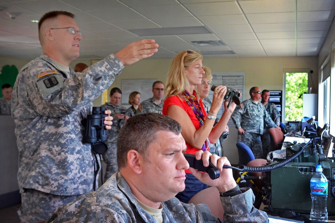 Army Chief Warrant Officer 2 Robert Cook explains from the forward ...