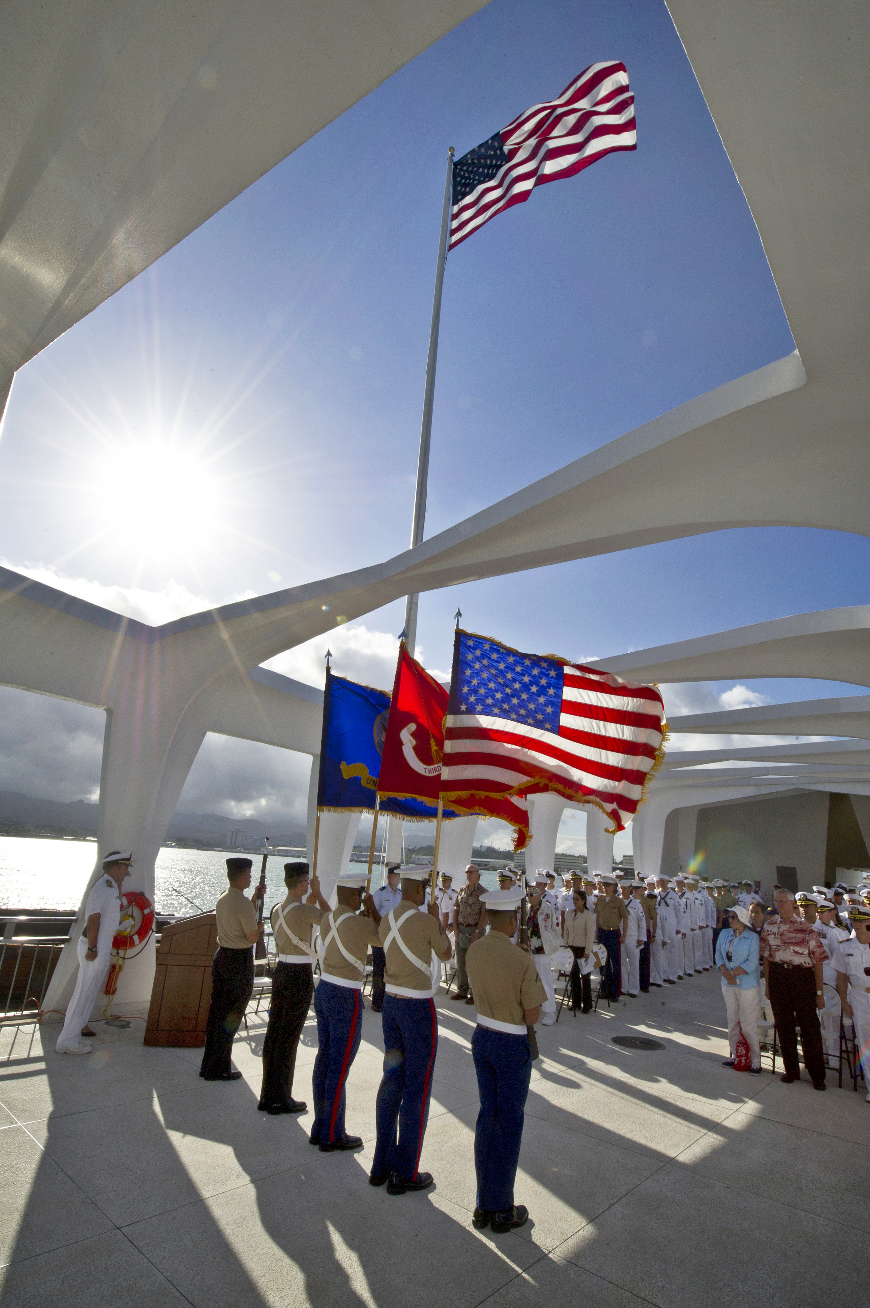 A Navy and Marine Corps color guard parades the colors on the USS ...