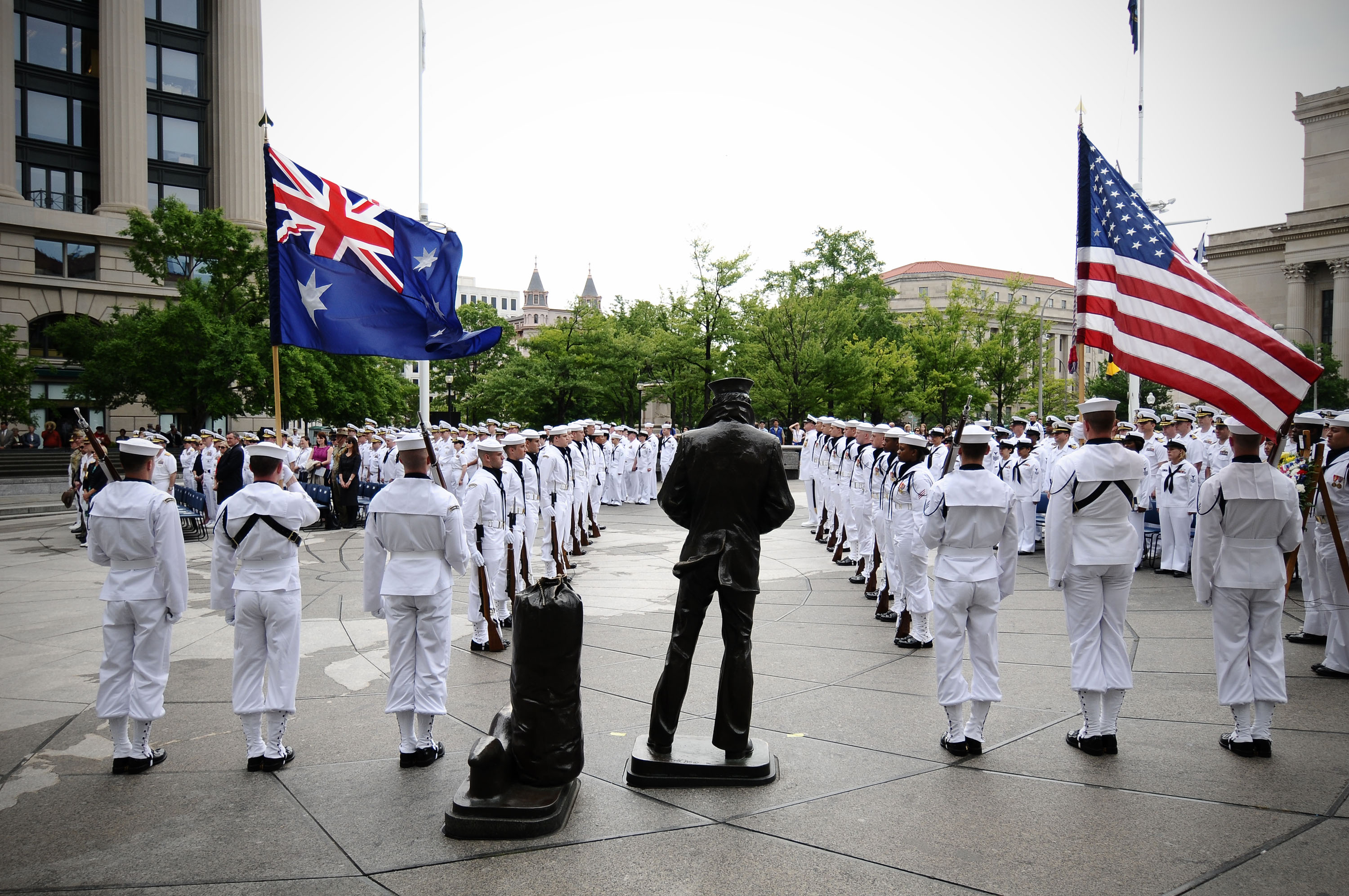 Members of the U.S. Navy Ceremonial Guard post the colors near the Lone ...