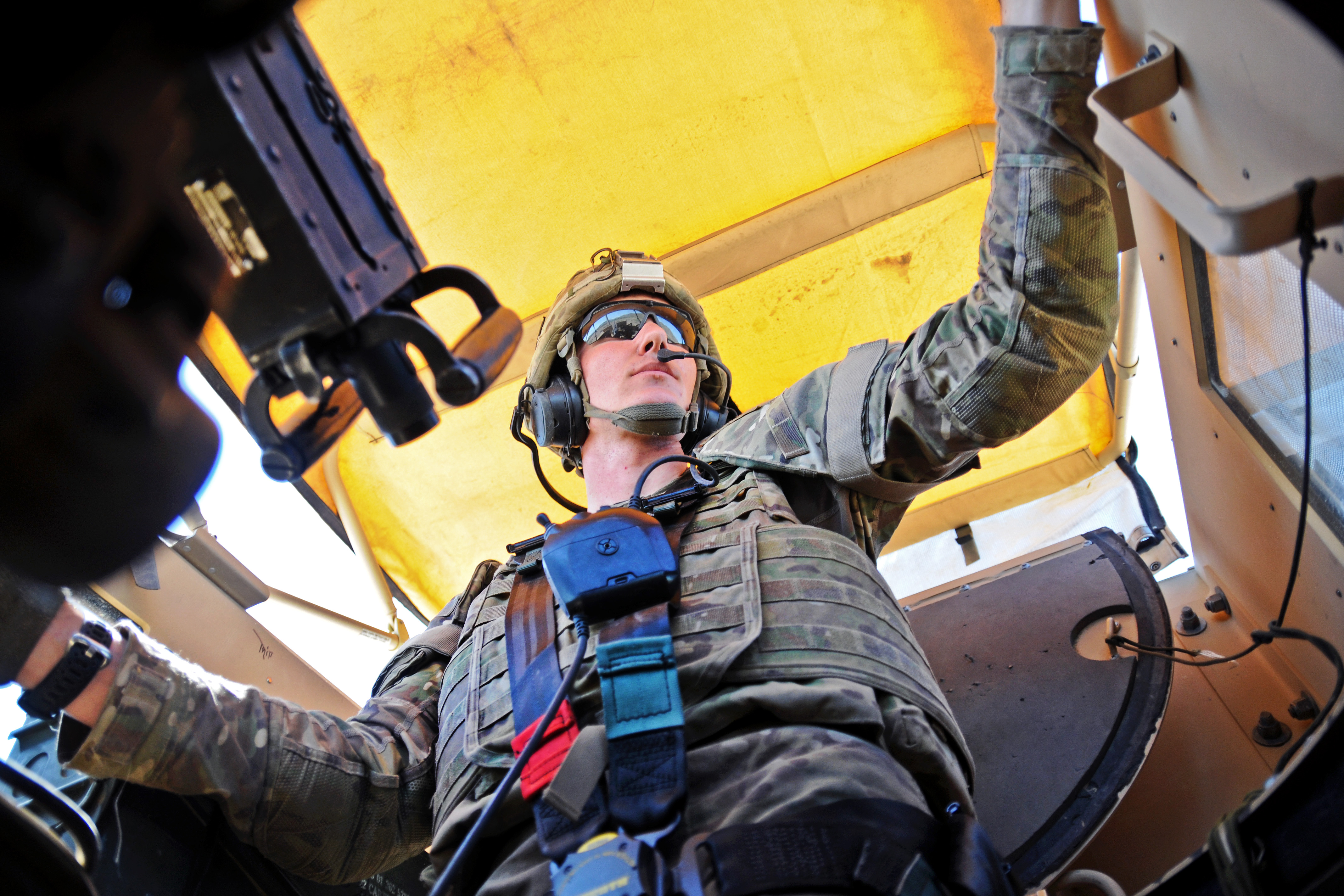 U.S. Army Pfc. Aaron Bowers scans his sector during a mounted patrol in ...