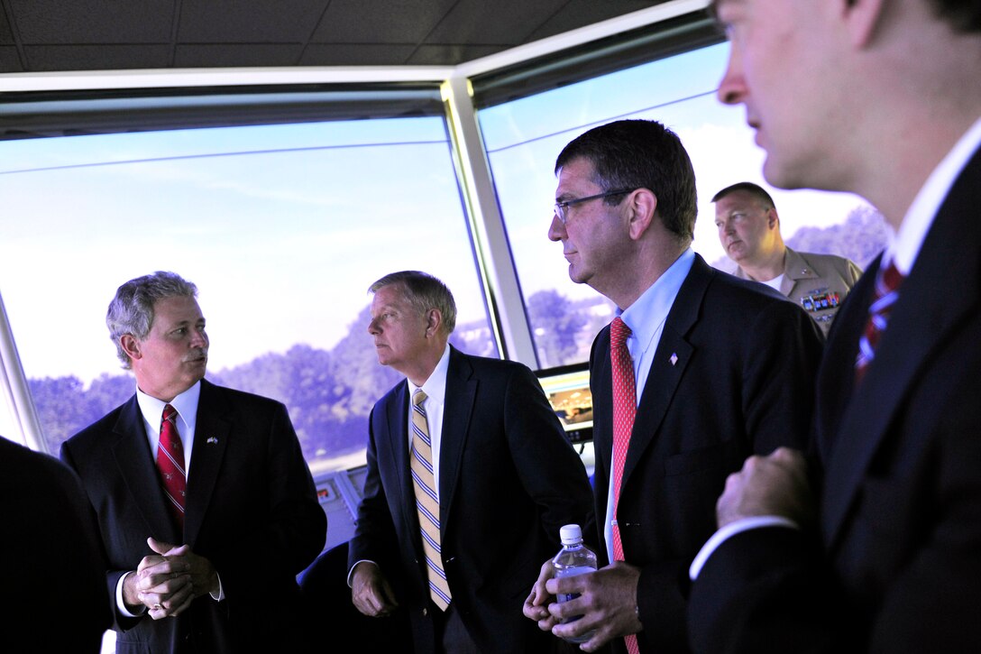 Phil Braswell, left, briefs U.S. Sen. Lindsey Graham of South Carolina ...