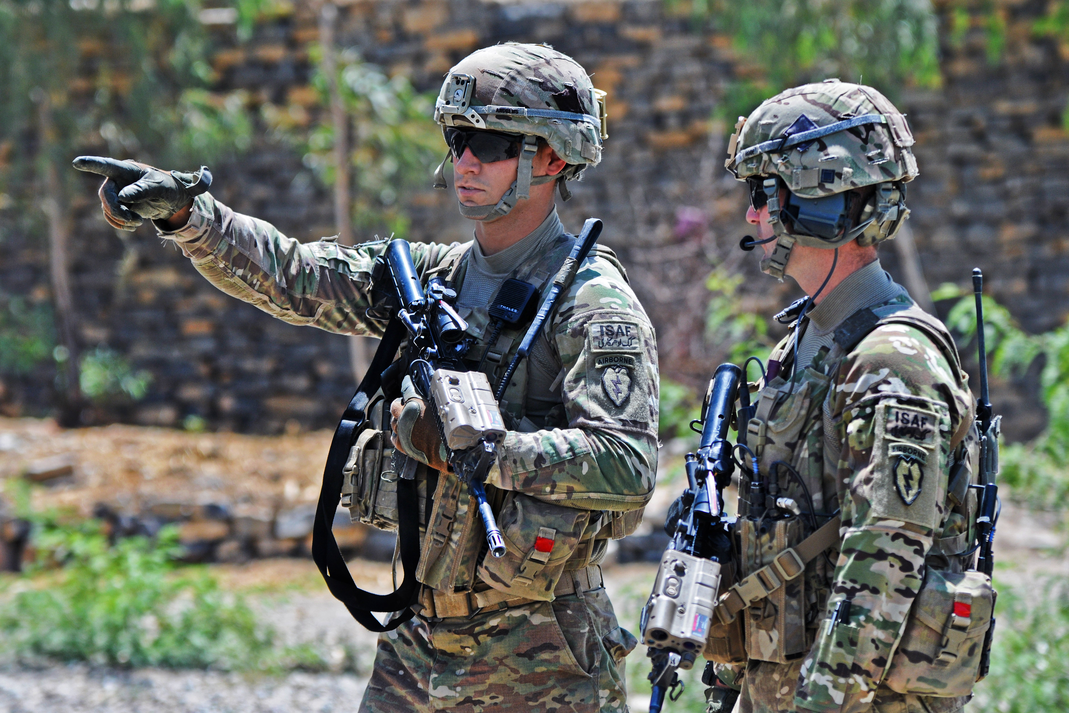 U.S. Army Sgt. Gregory Andrews, left, shows his squad's locations to U ...