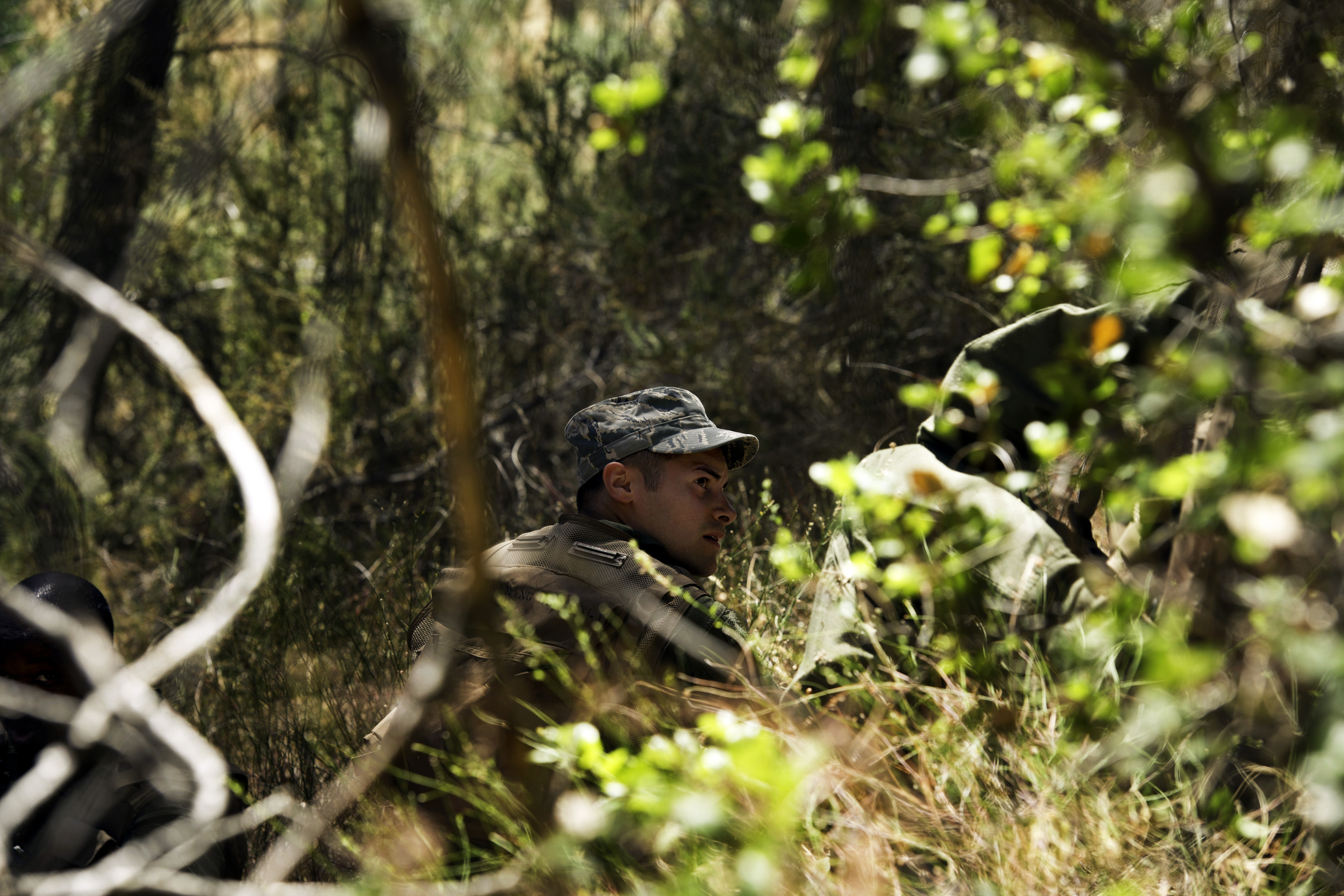 Air Force Staff Sgt. Genesis Santiago takes a short rest during a downed aircraft scenario while ...