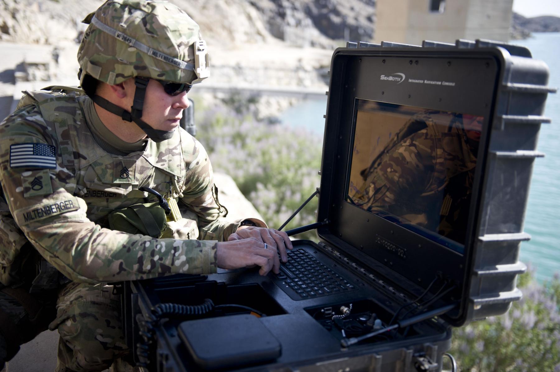 Soldier operates a remote-controlled submersible in Afghanistan