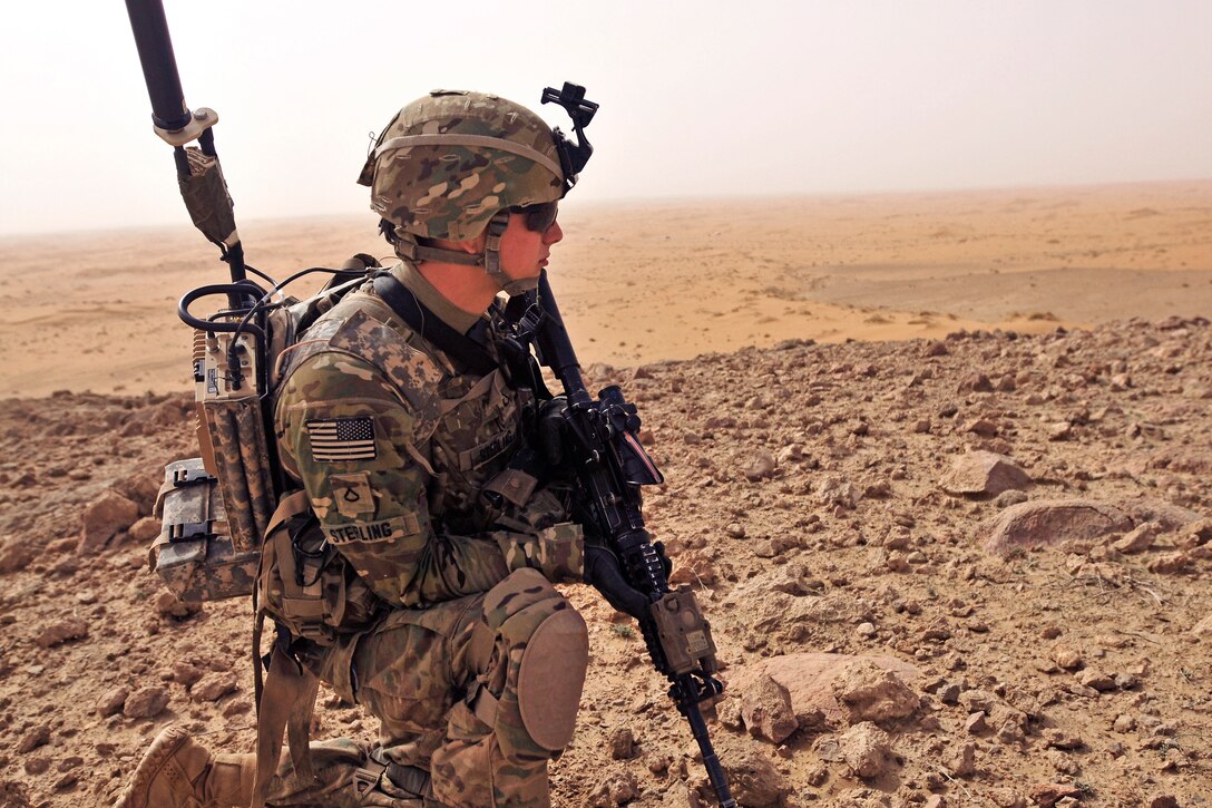 U.S. Army Pfc. Bryce Sterling keeps a watchful eye during a vehicle ...