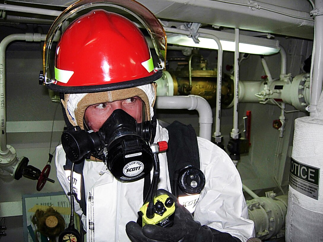 U.S. Navy Petty Officer 3rd Class Robert Phillips speaks with the ...