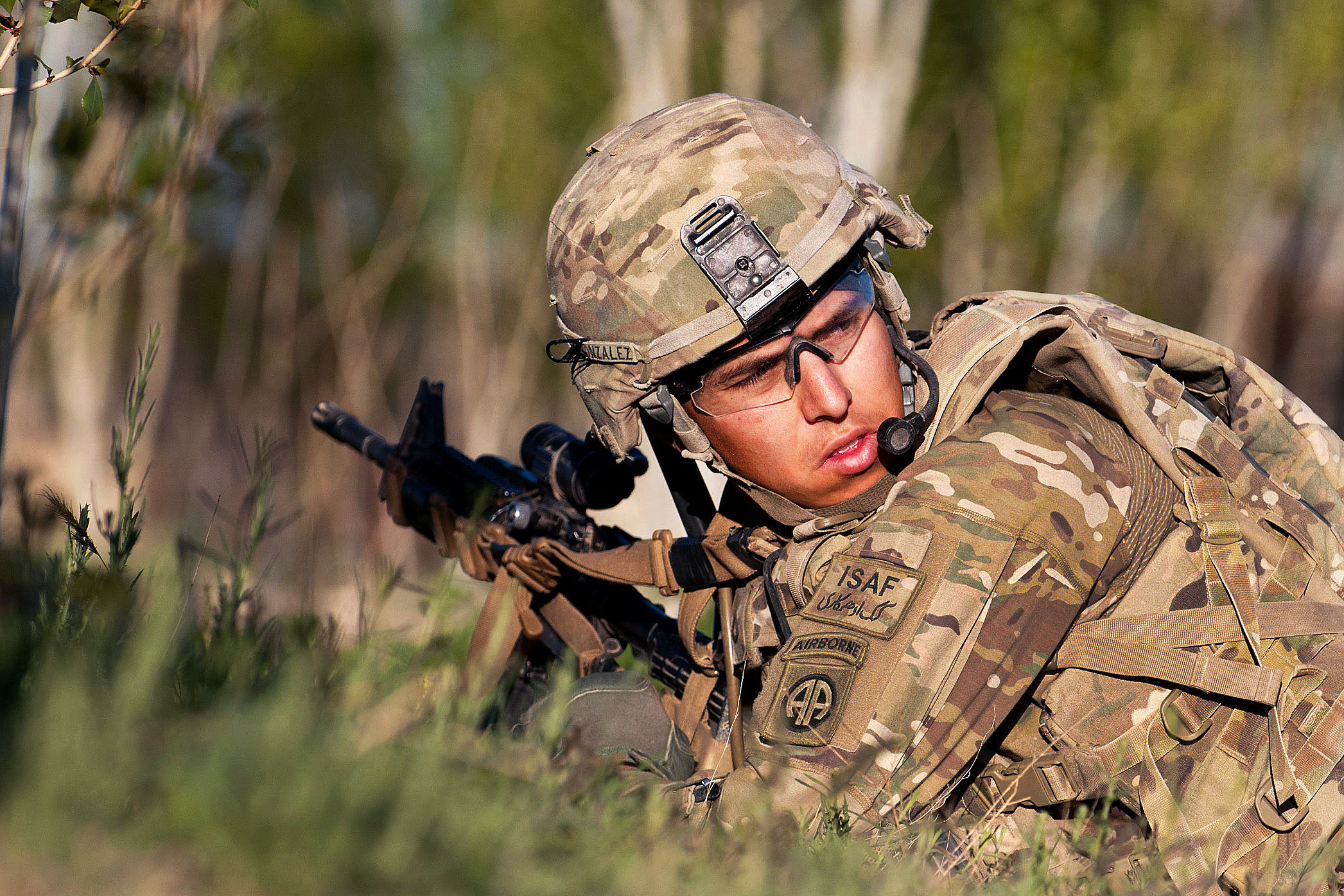 U.S. Army Pfc. David Gonzalez briefly looks over his shoulder during a ...
