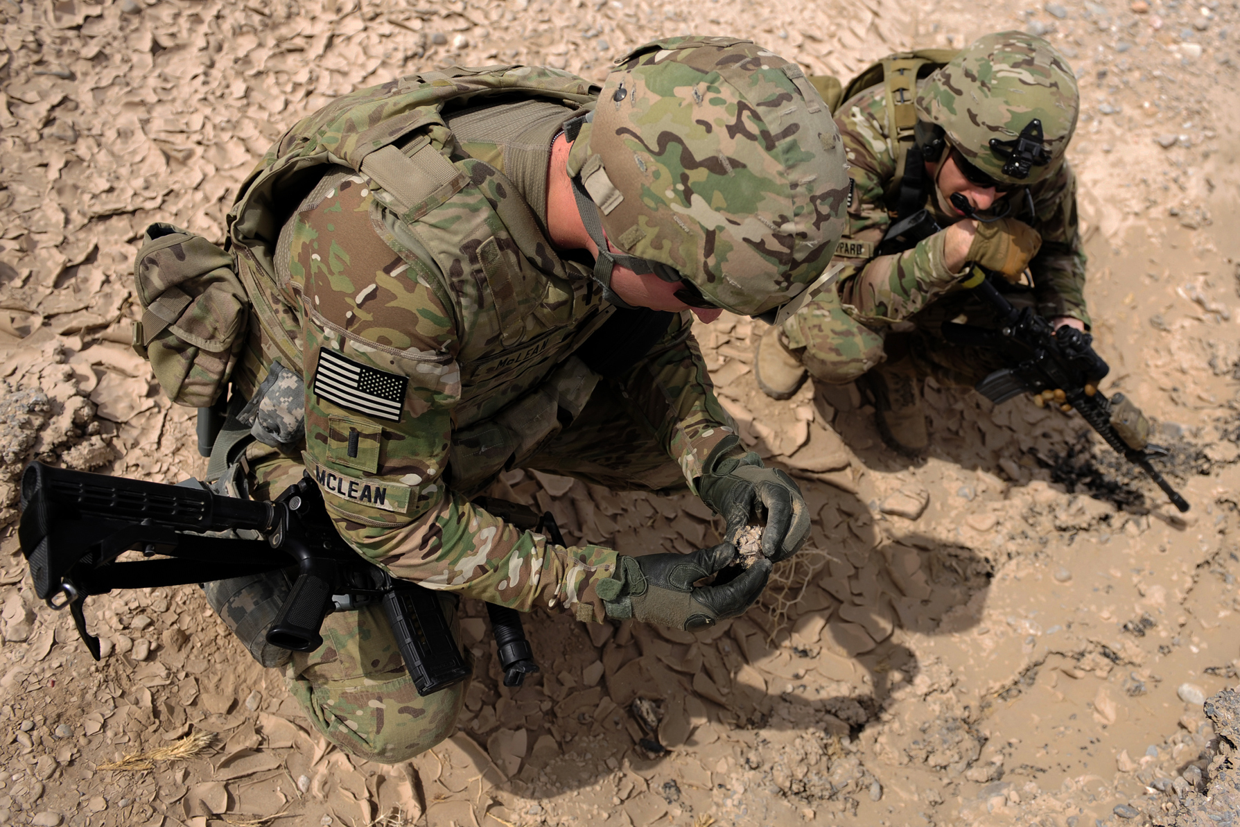 U.S. Navy Cmdr. Thomas A. Sheppard, right, and Lt. j.g. Brian McLean ...
