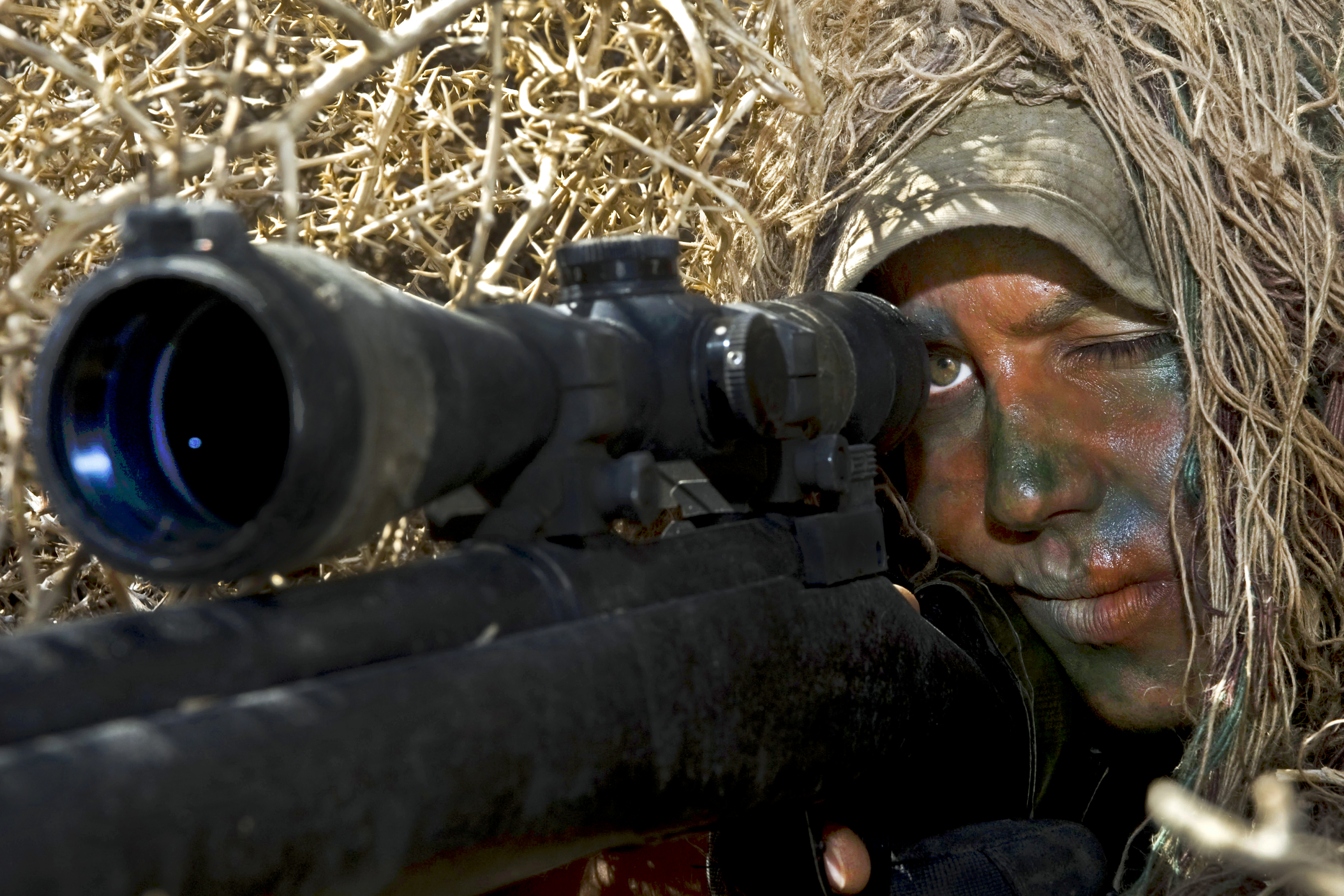 U.S. Air Force Staff Sgt. Alyssa Gomez peers down the scope of her M24 ...